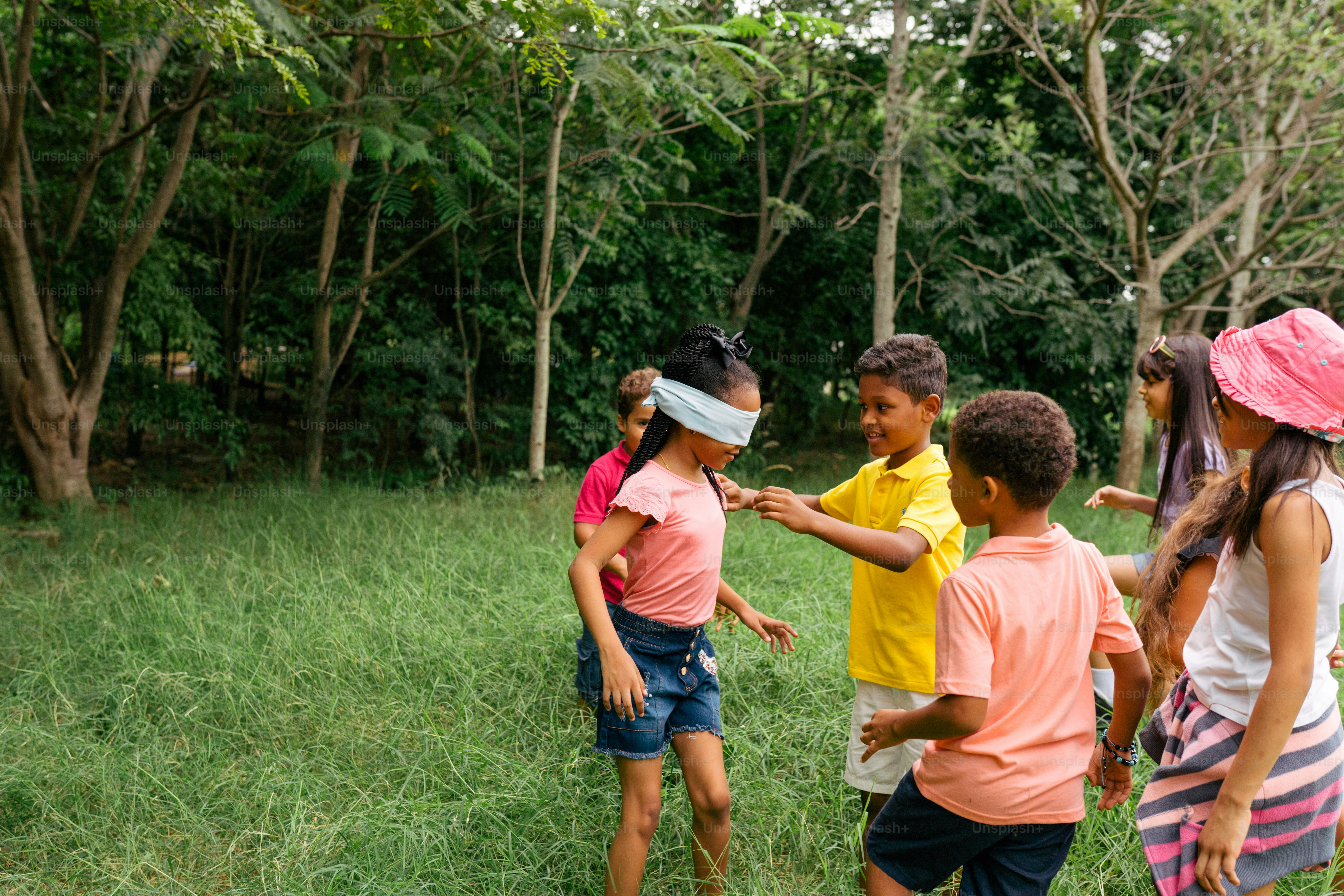 A group of children playing a game of mini golf photo – Adventure Image ...