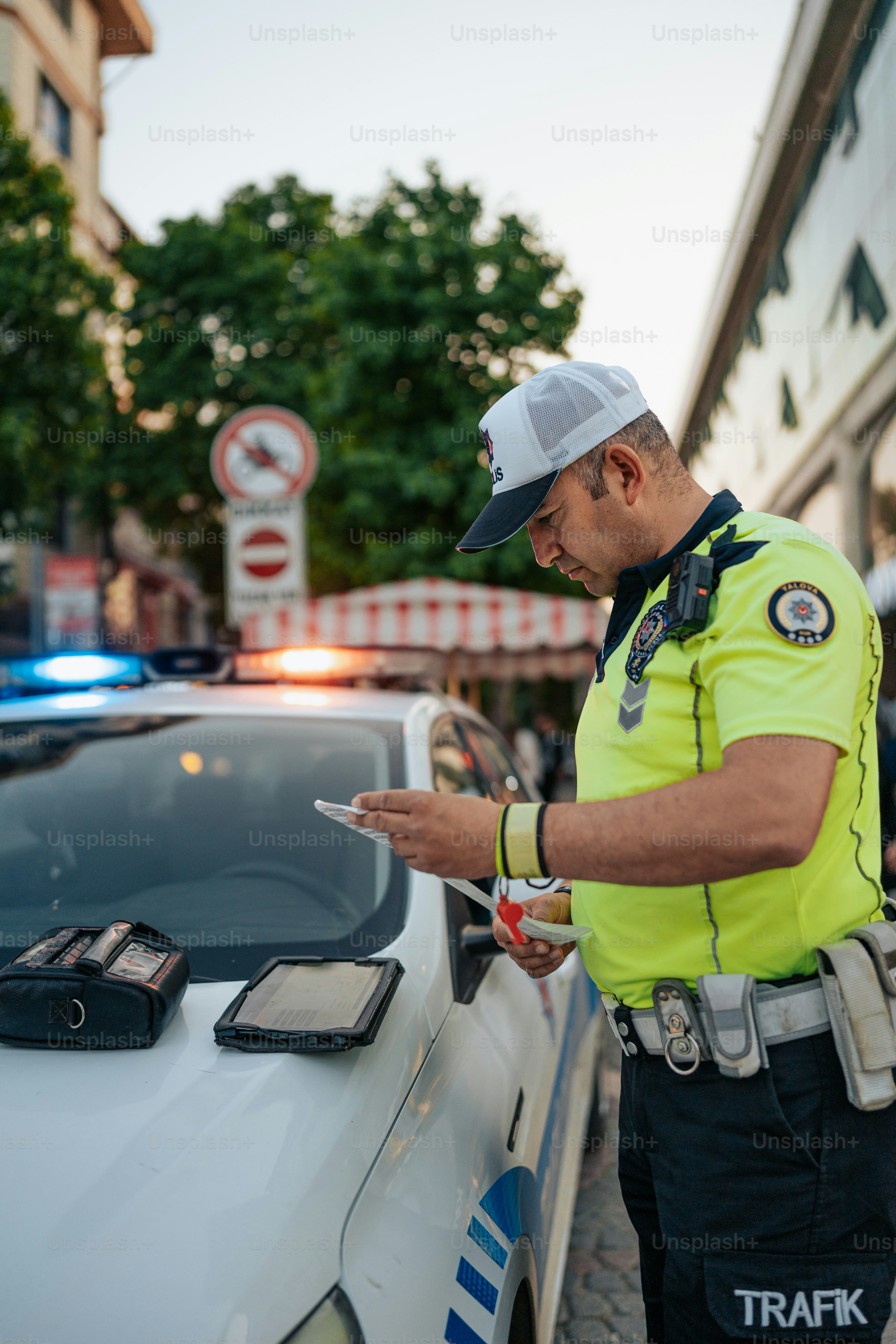 A close up of a police car with its lights on photo – Police Image on ...