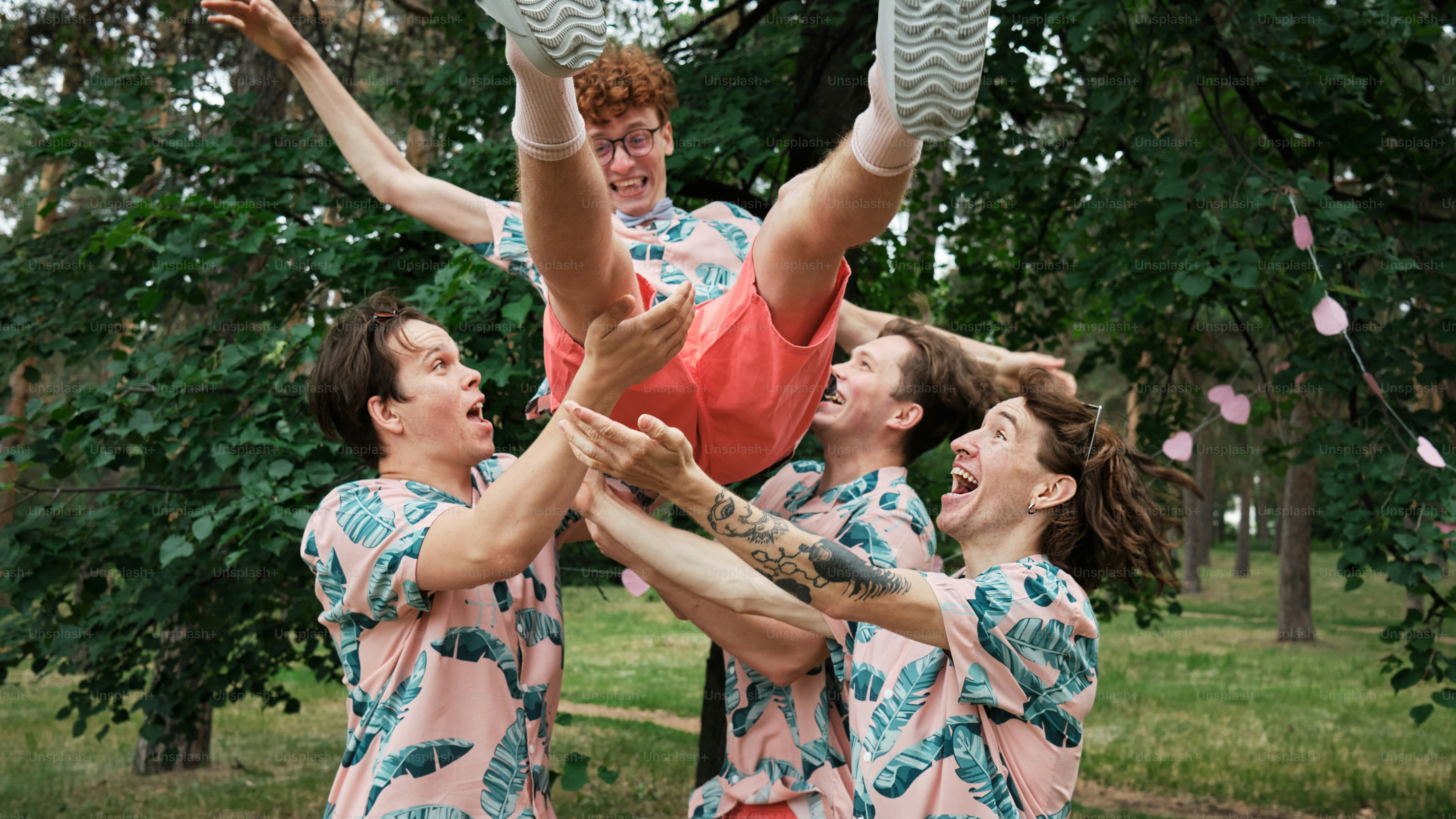 A group of people in a park playing with a frisbee photo – Bachelor ...