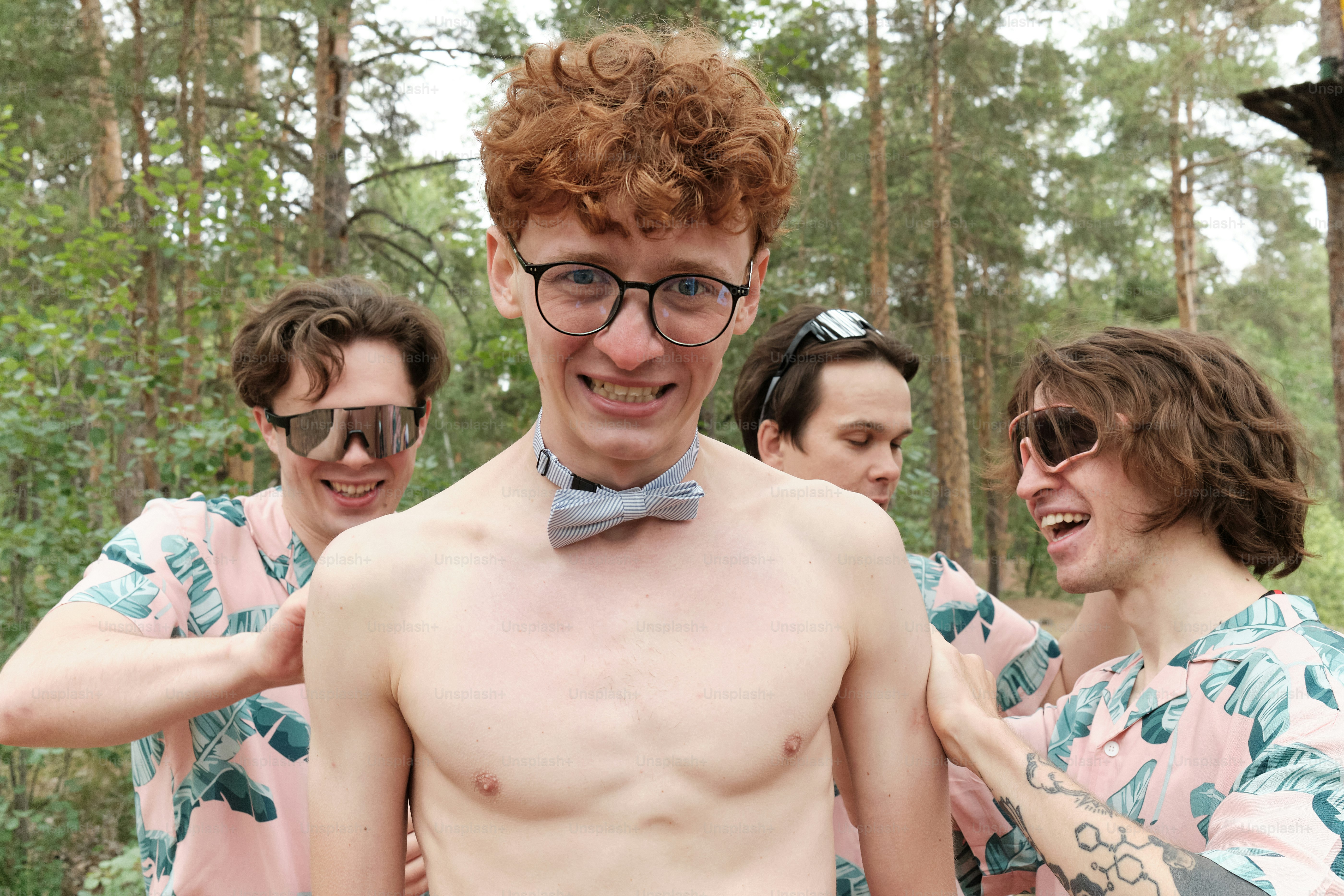 A group of young men standing next to each other photo – Bachelor party ...