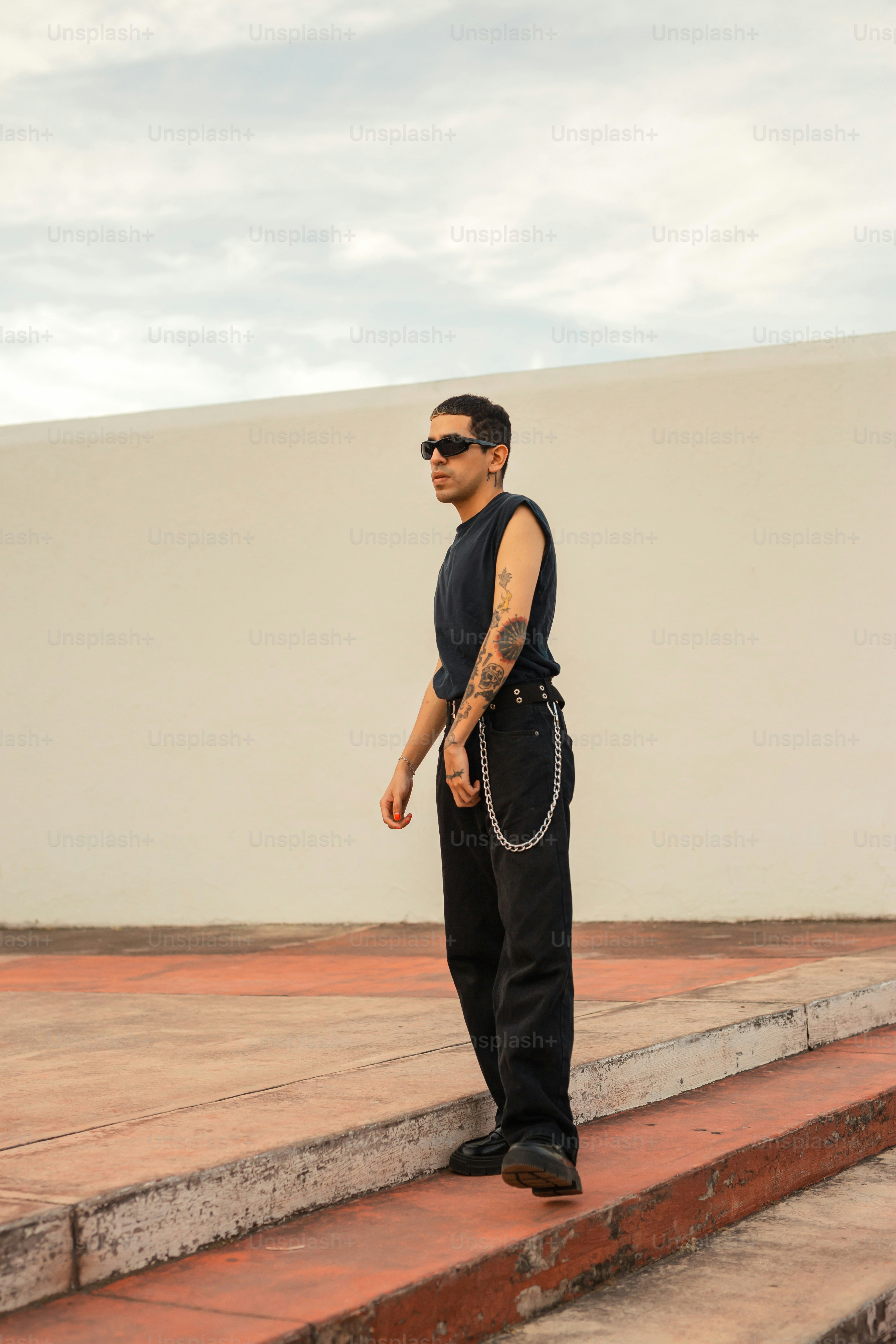 A man with a chain on his arm photo – Mens Image on Unsplash