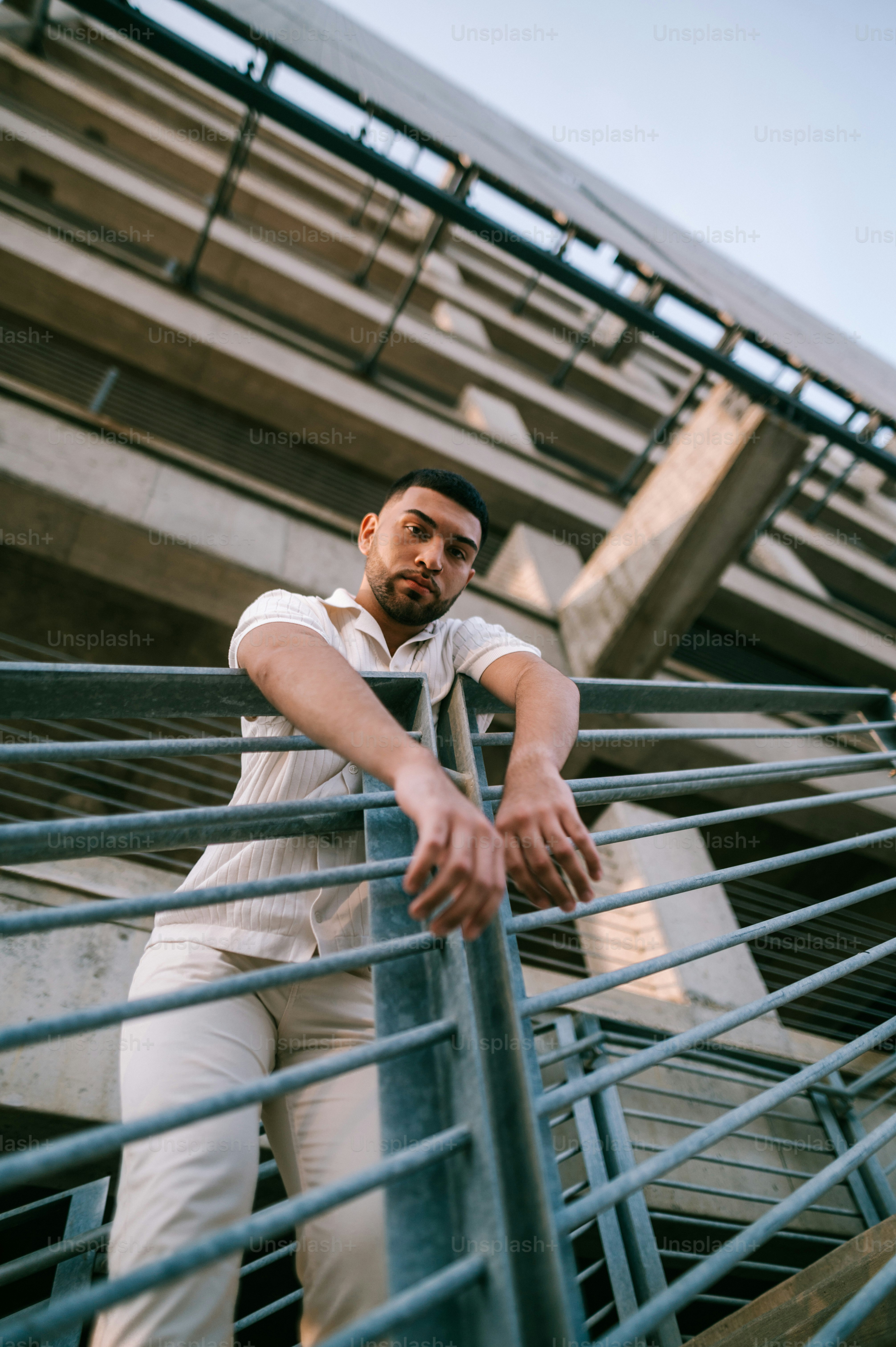 A man laying down on a concrete ledge photo – Sad boy Image on Unsplash
