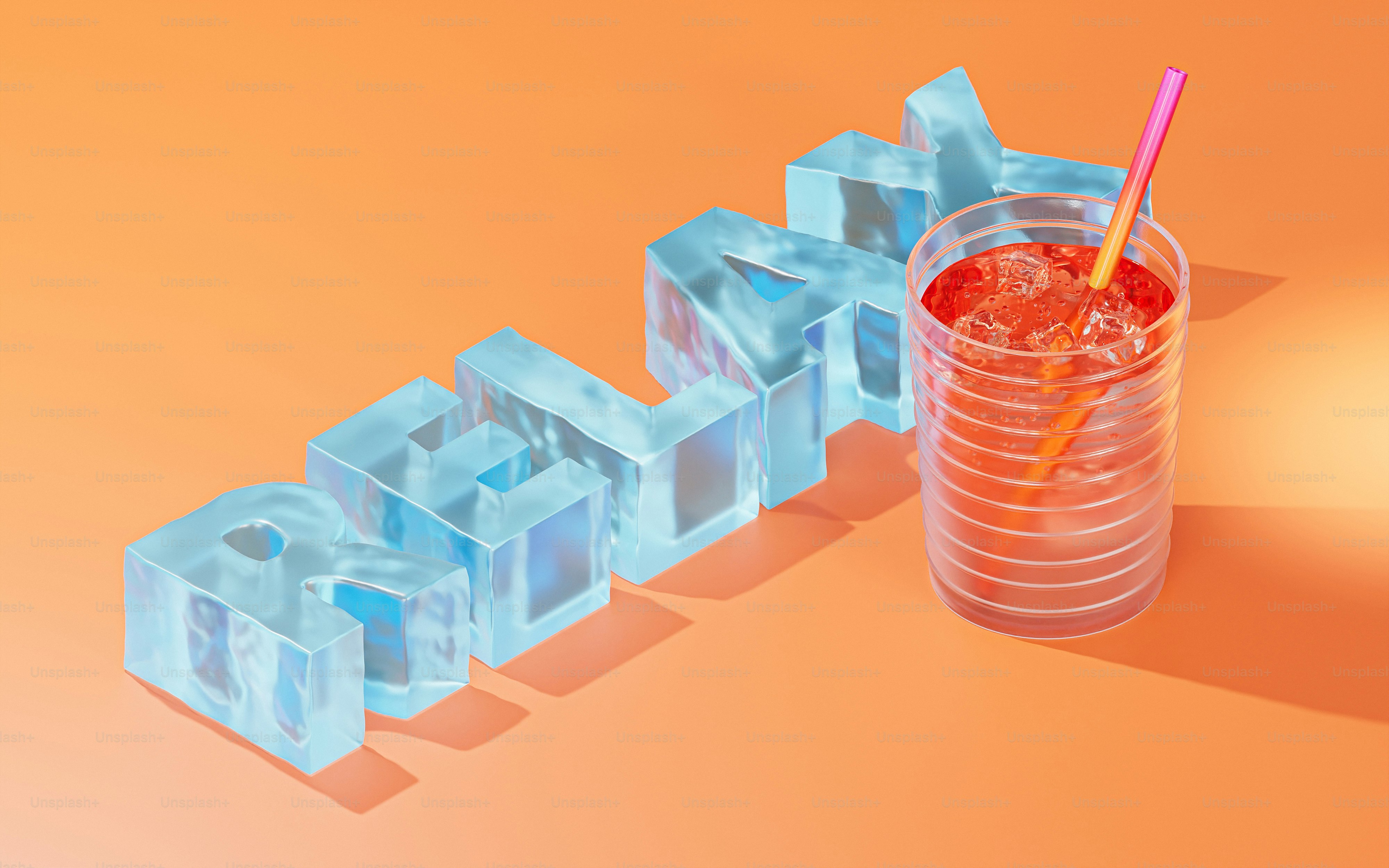 A drink in a tall glass next to the letters of the alphabet photo ...