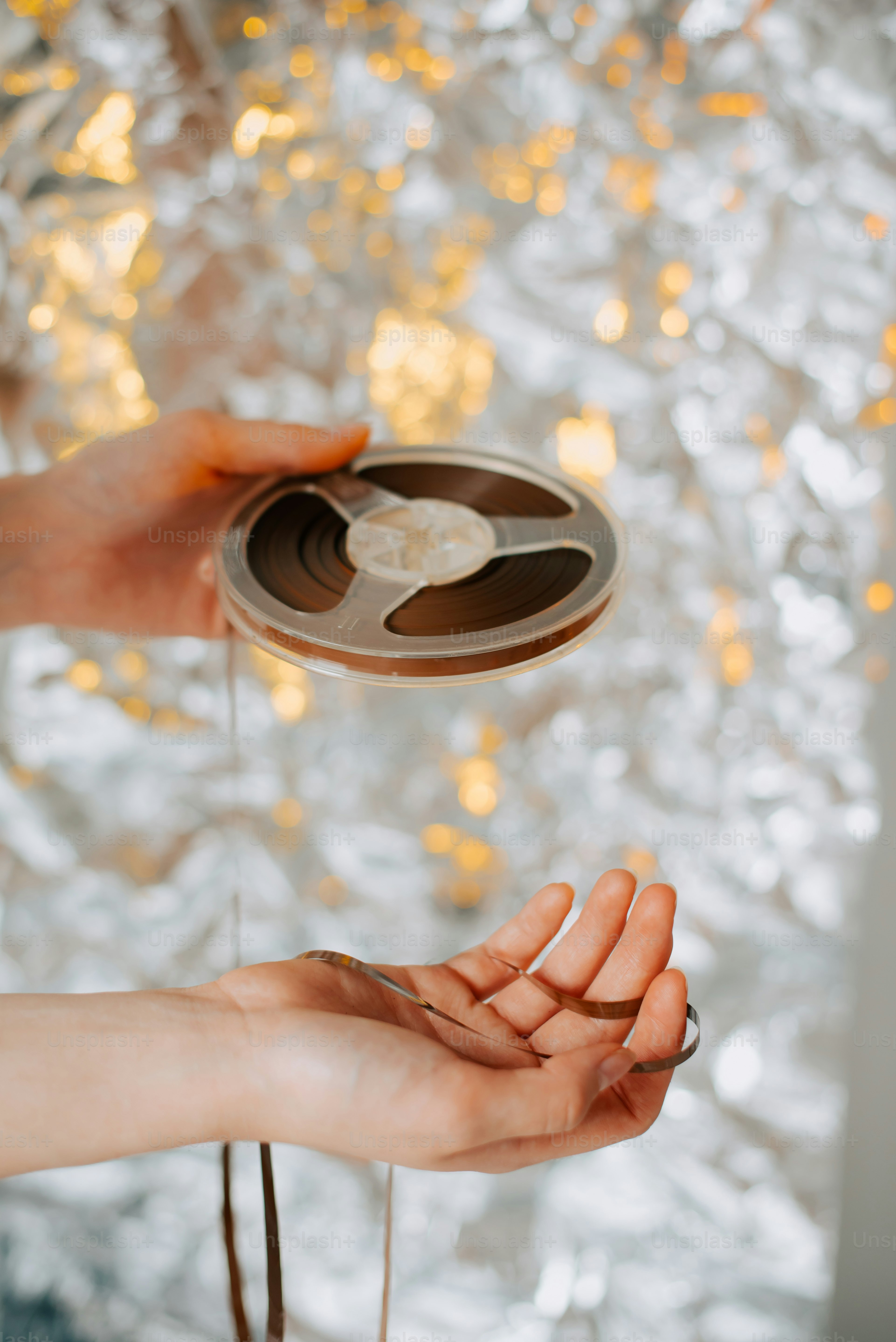 A person holding a film reel in their hand photo – Movie Image on Unsplash