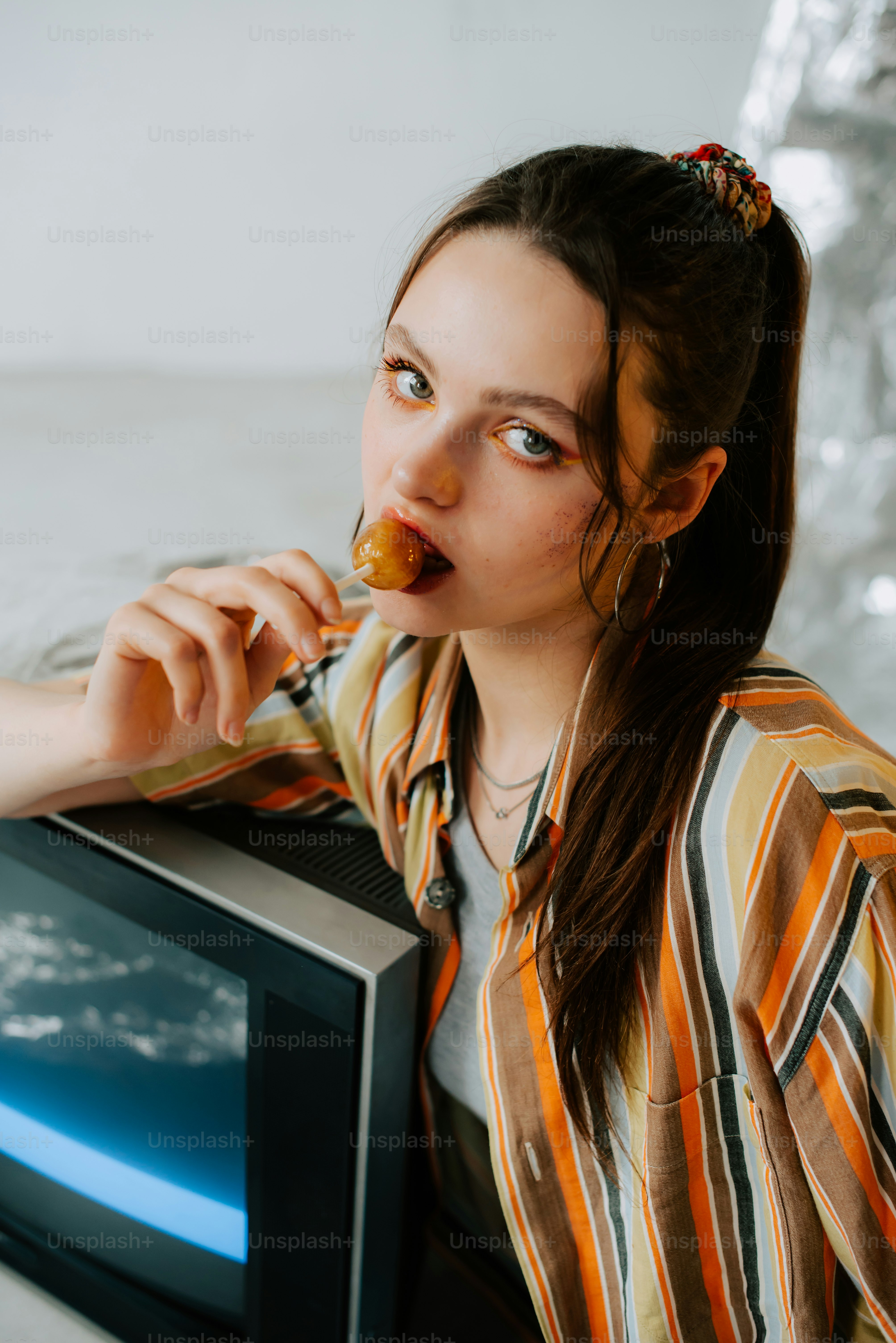 A woman is eating something out of a microwave photo – Retro Image on ...