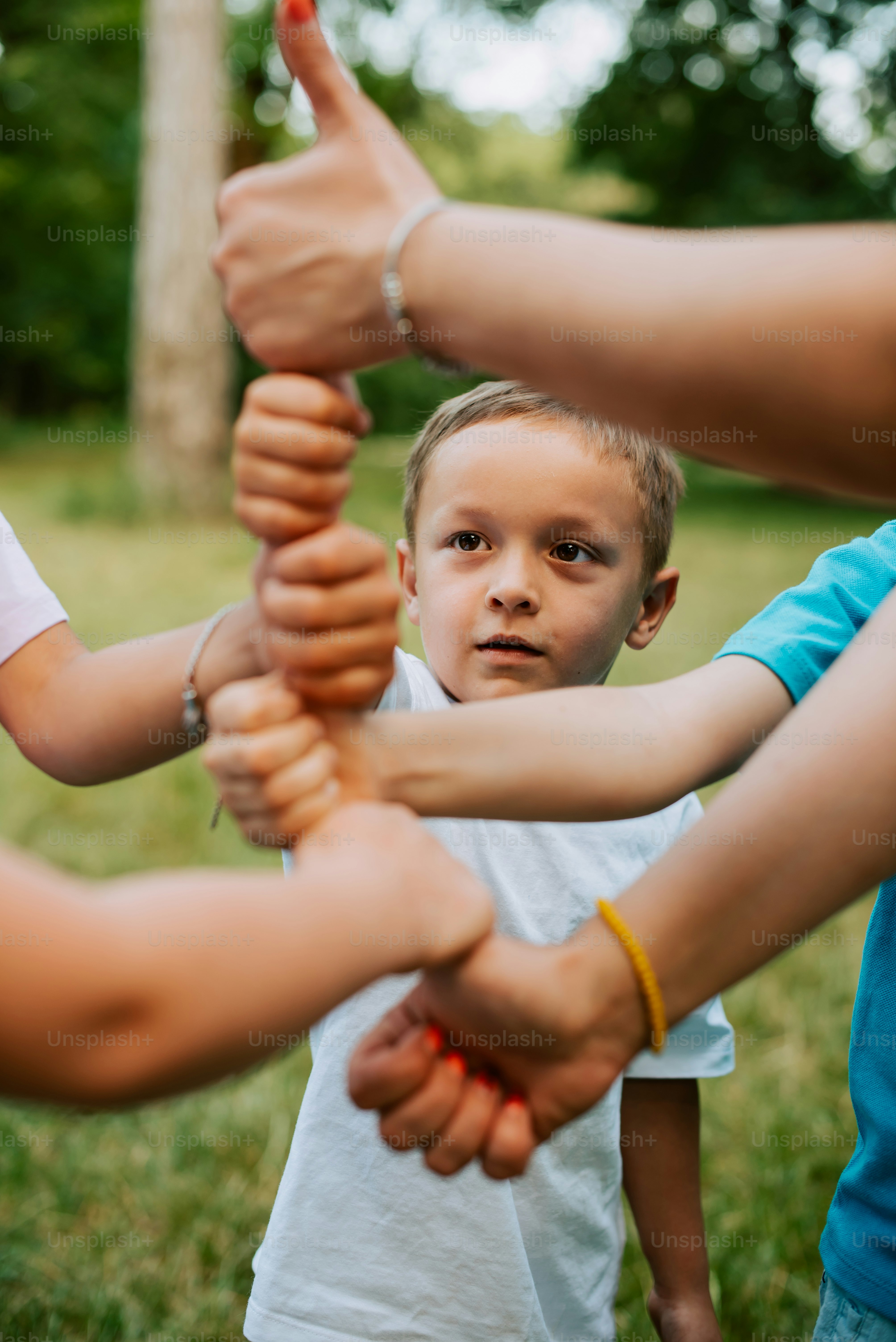 A group of children holding hands in a circle photo – Foster care Image ...