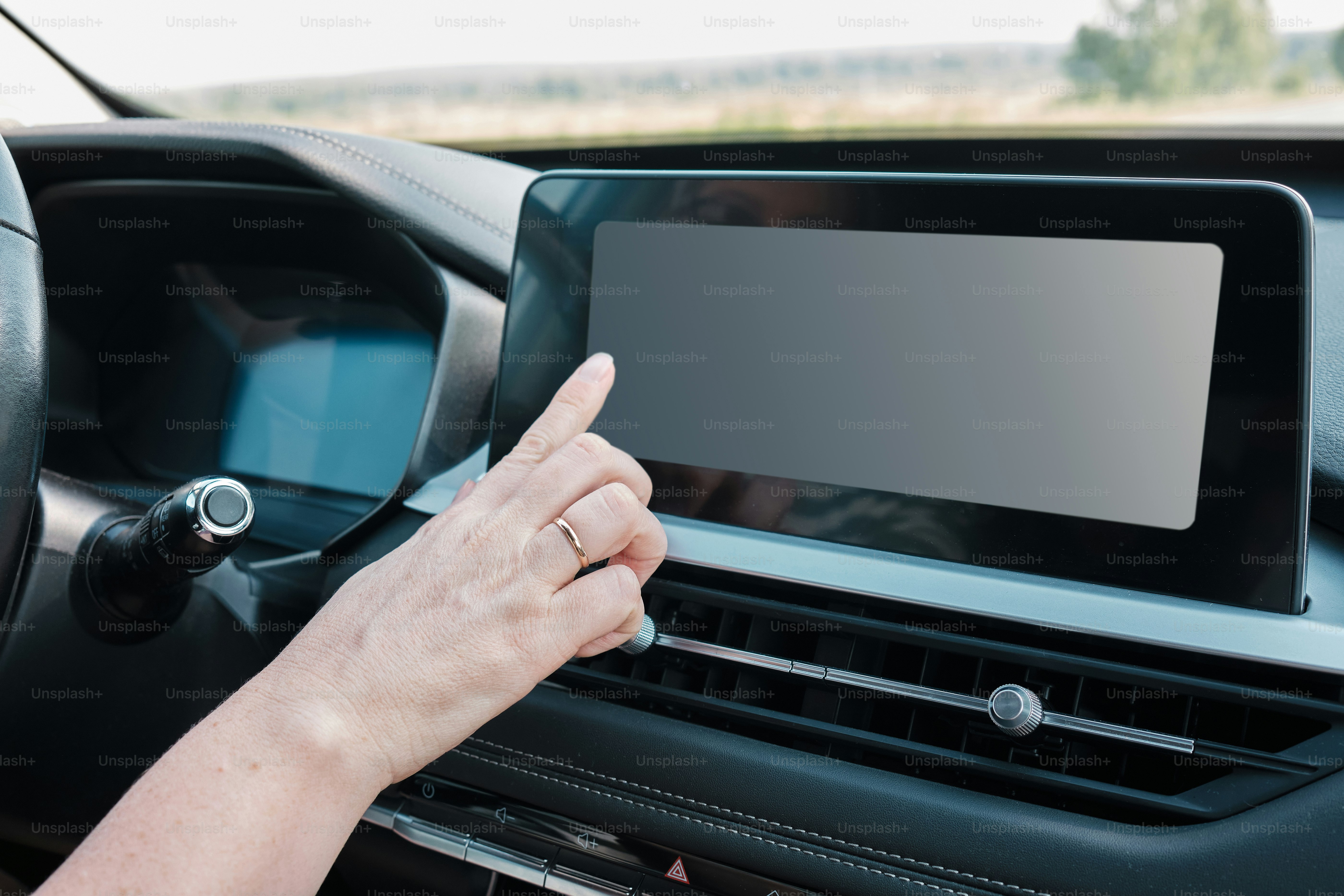 A person holding a tablet in a car photo – Summer travel Image on Unsplash