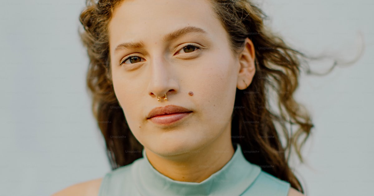 A Woman With A Tattoo On Her Arm Photo Fashion Image On Unsplash