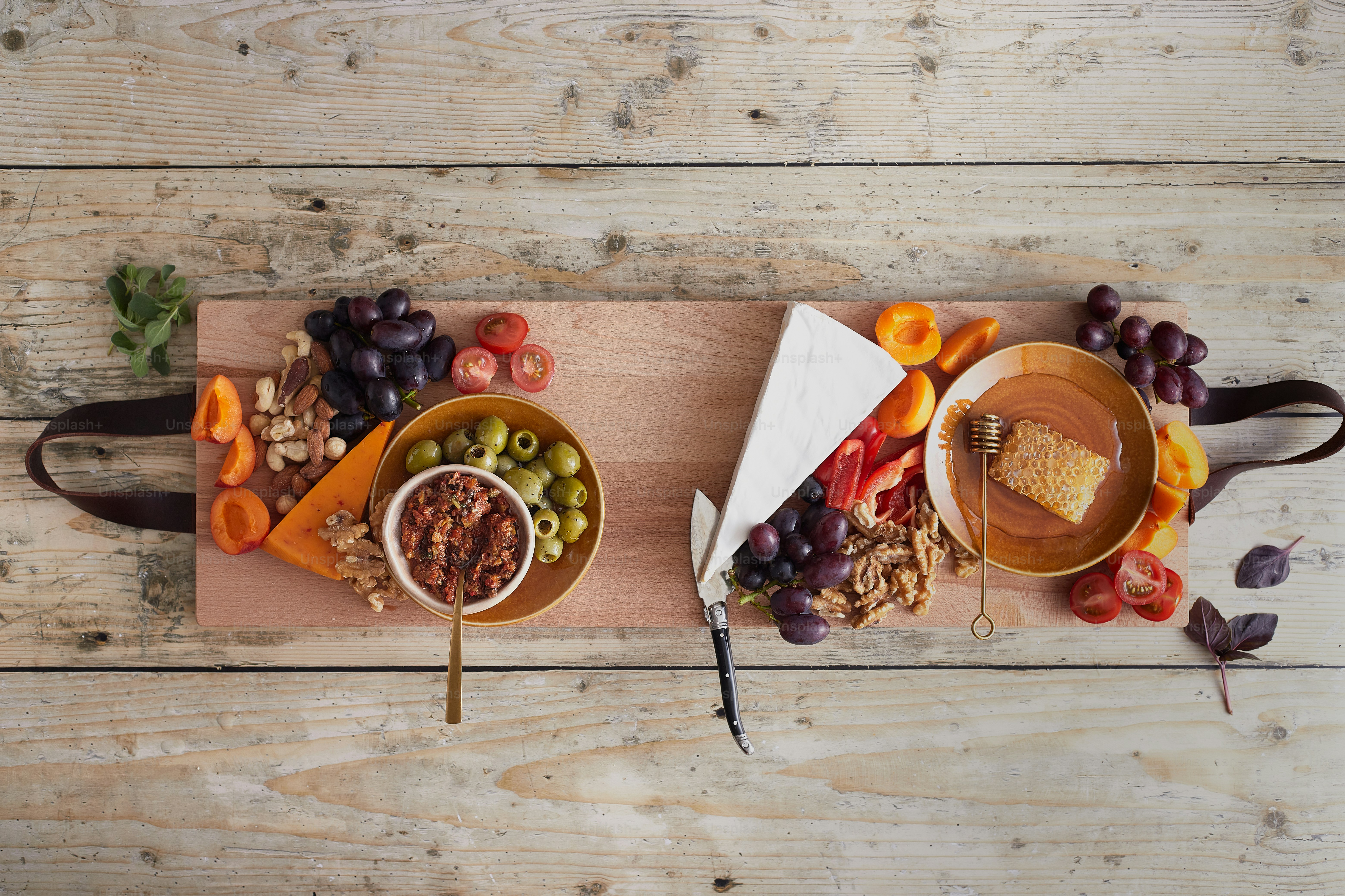 A wooden table topped with a platter of food photo – Nuts Image on Unsplash