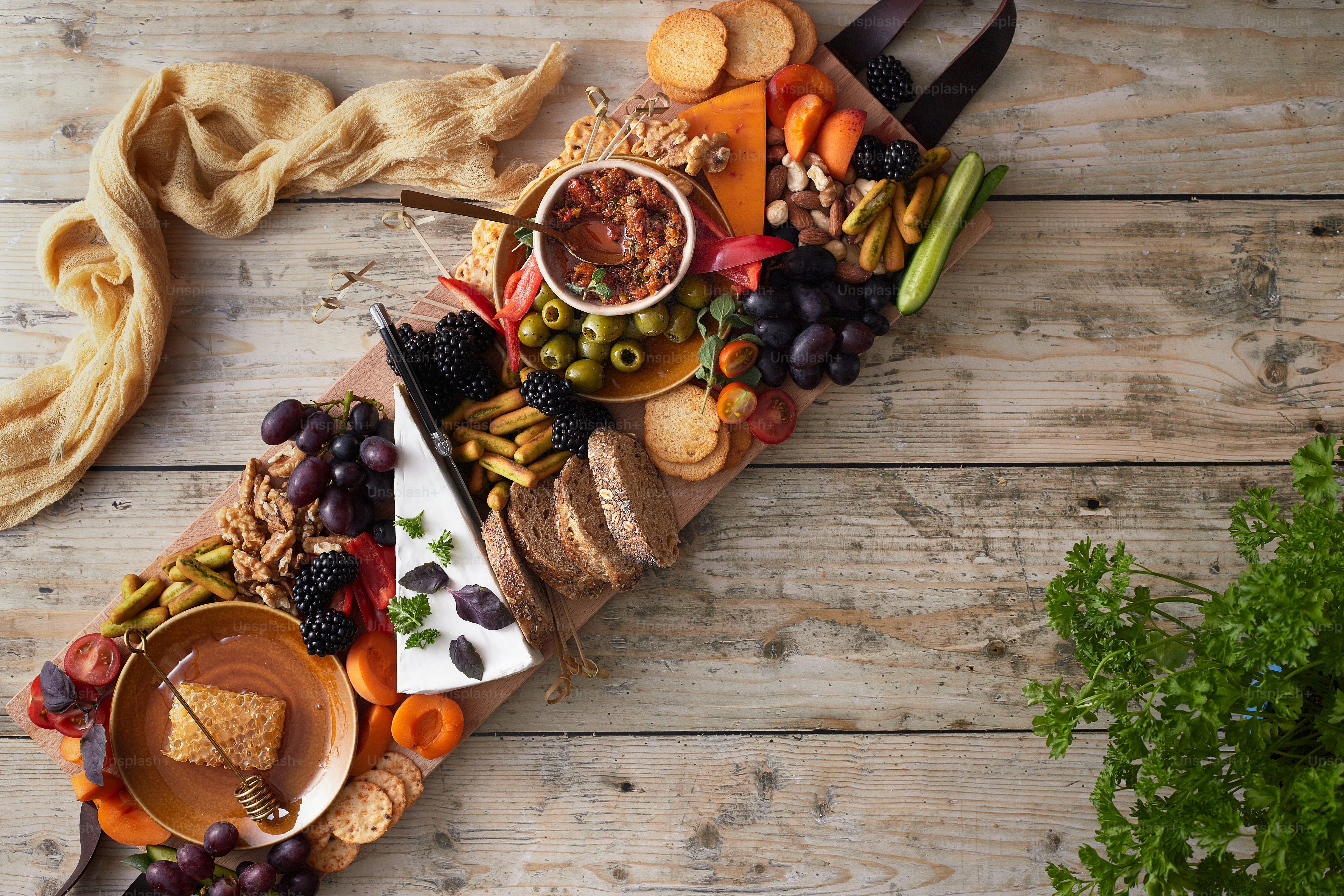 A wooden table topped with a platter of food photo – Nuts Image on Unsplash