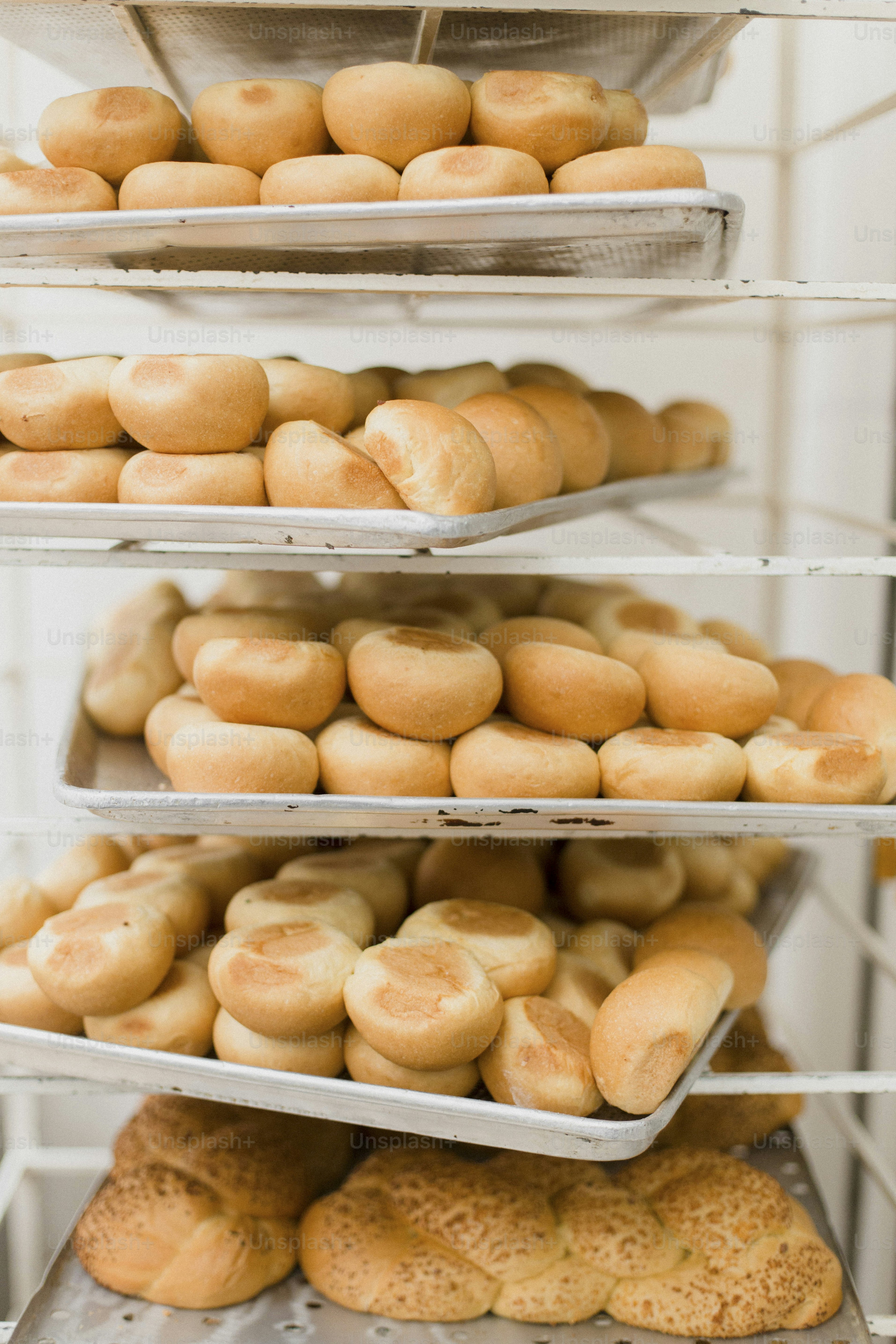 A bunch of breads that are on a rack photo – Bread Image on Unsplash
