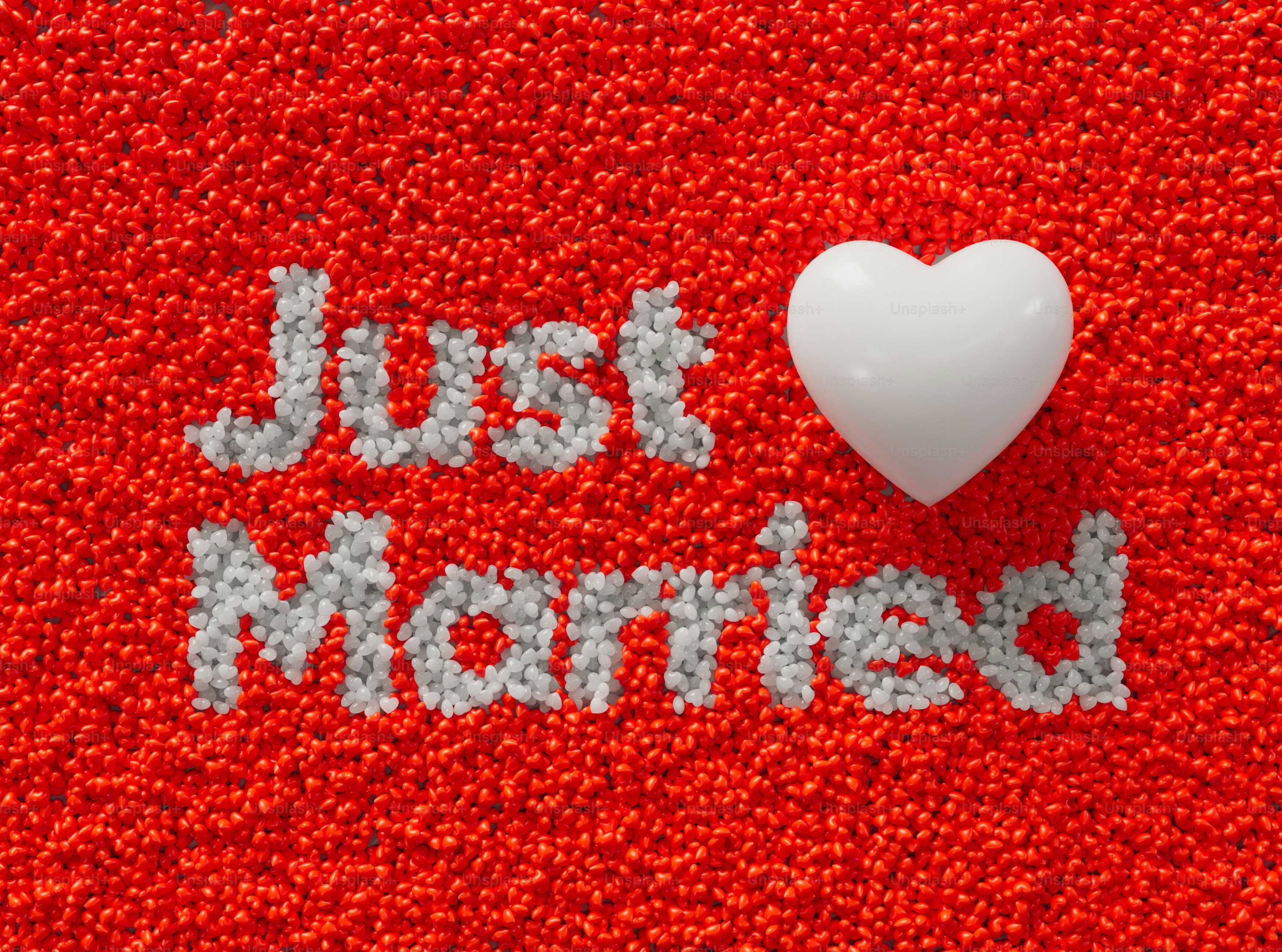 A white heart sitting on top of a red carpet photo – Type Image on Unsplash