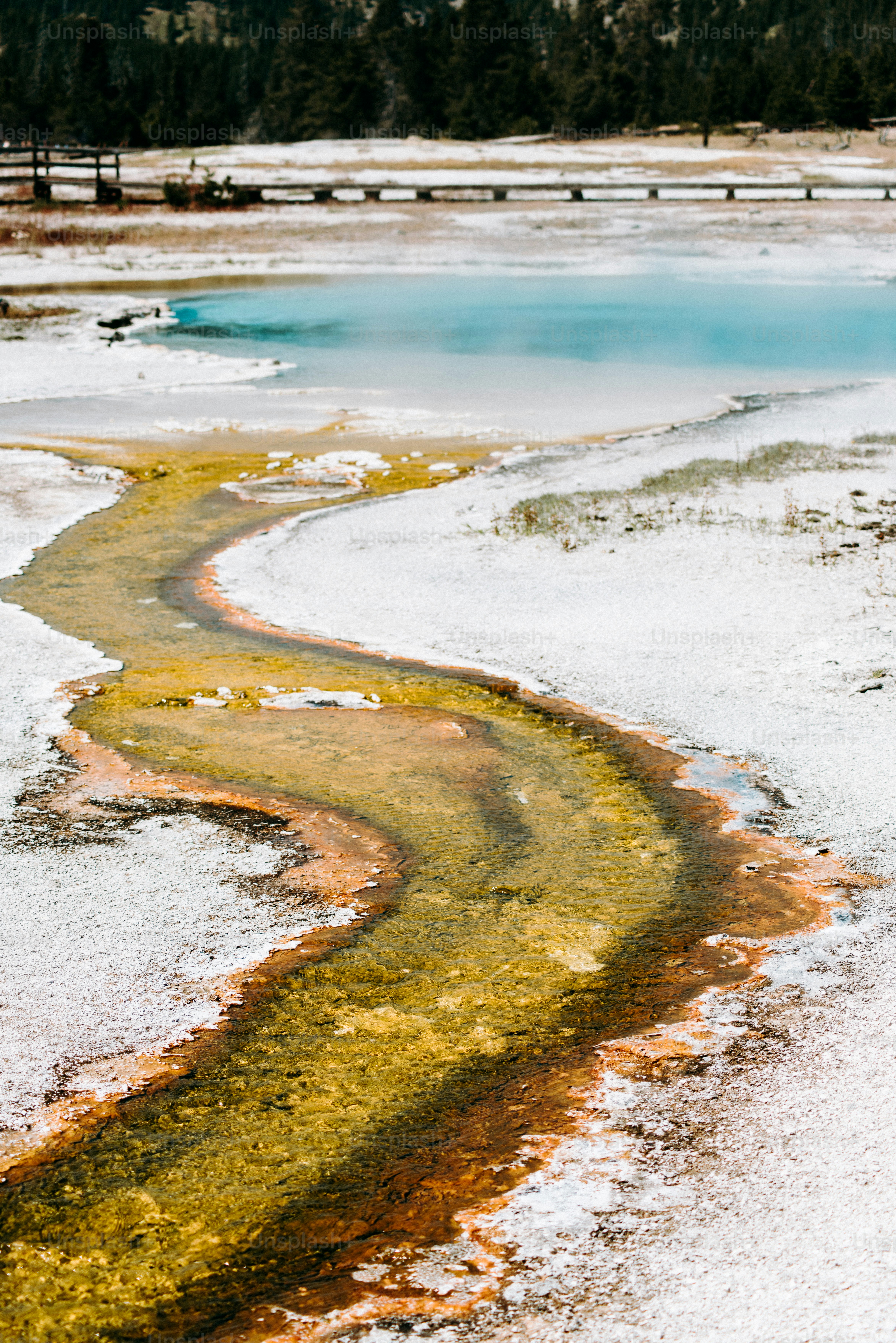 A river running through a snow covered field photo – Montana Image on ...
