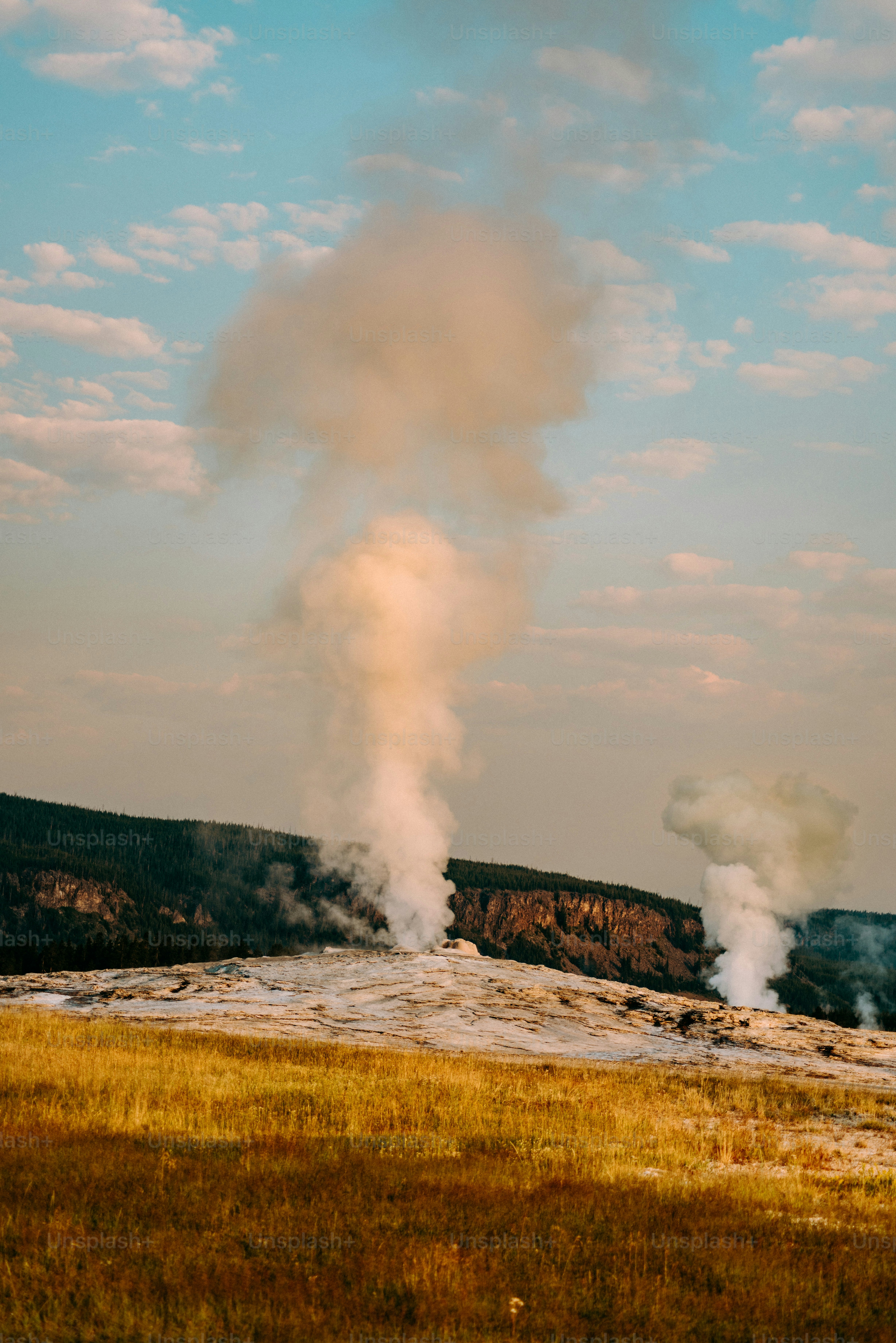 A large plume of steam rises into the sky photo – Montana Image on Unsplash