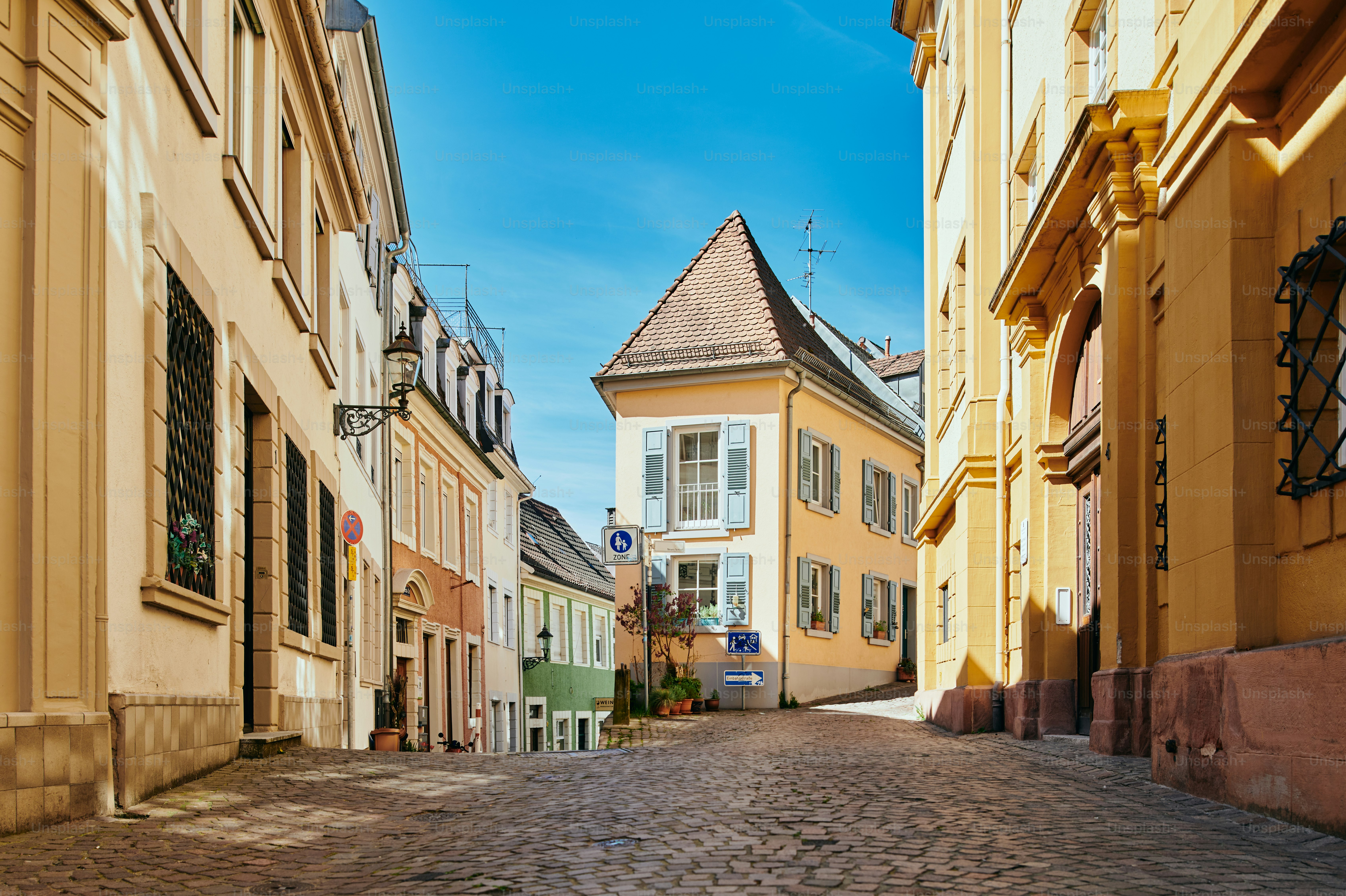 A view of a city with buildings and a clock tower photo – Germany Image ...