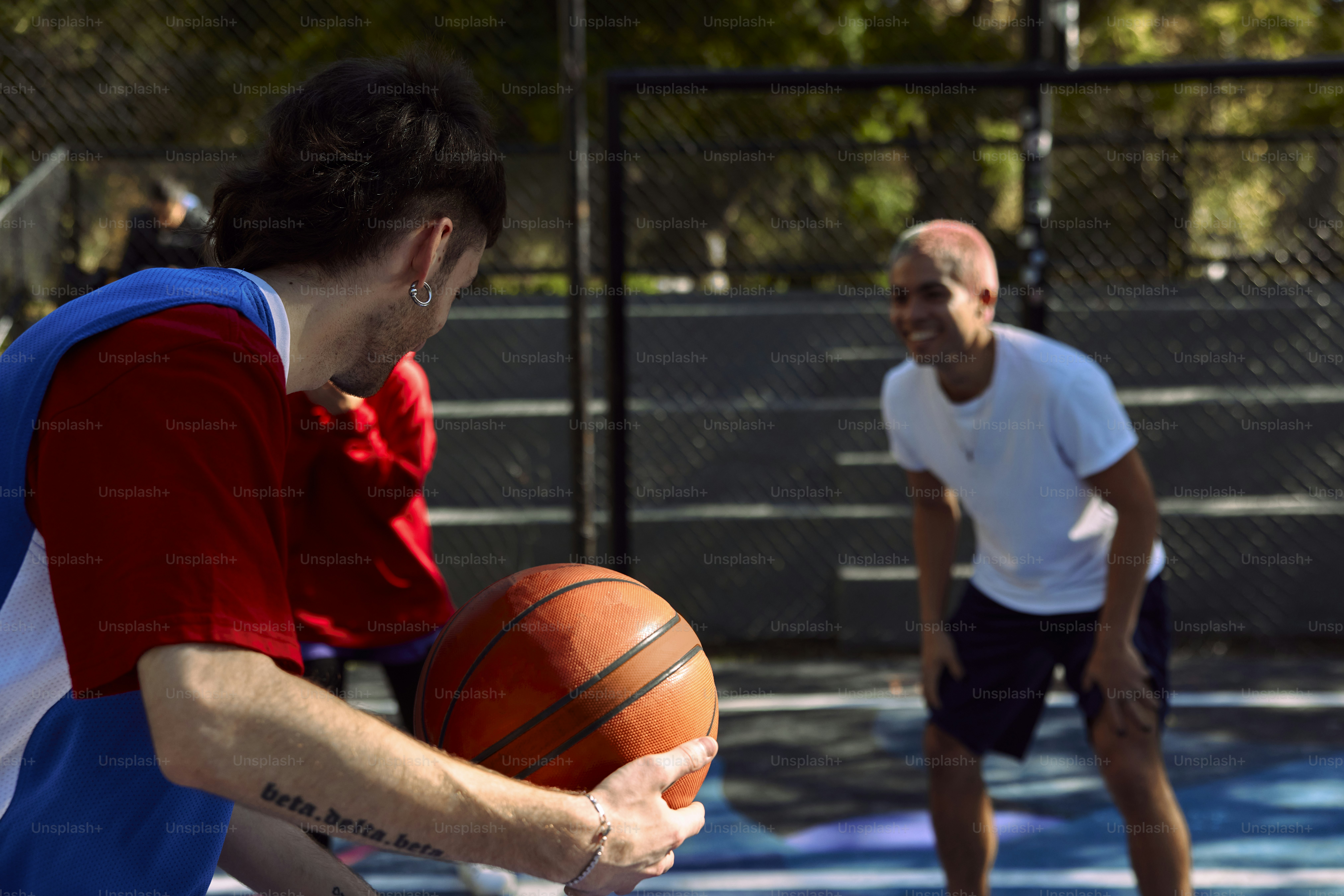 A man in a blue and red shirt and a man in a blue and red photo ...