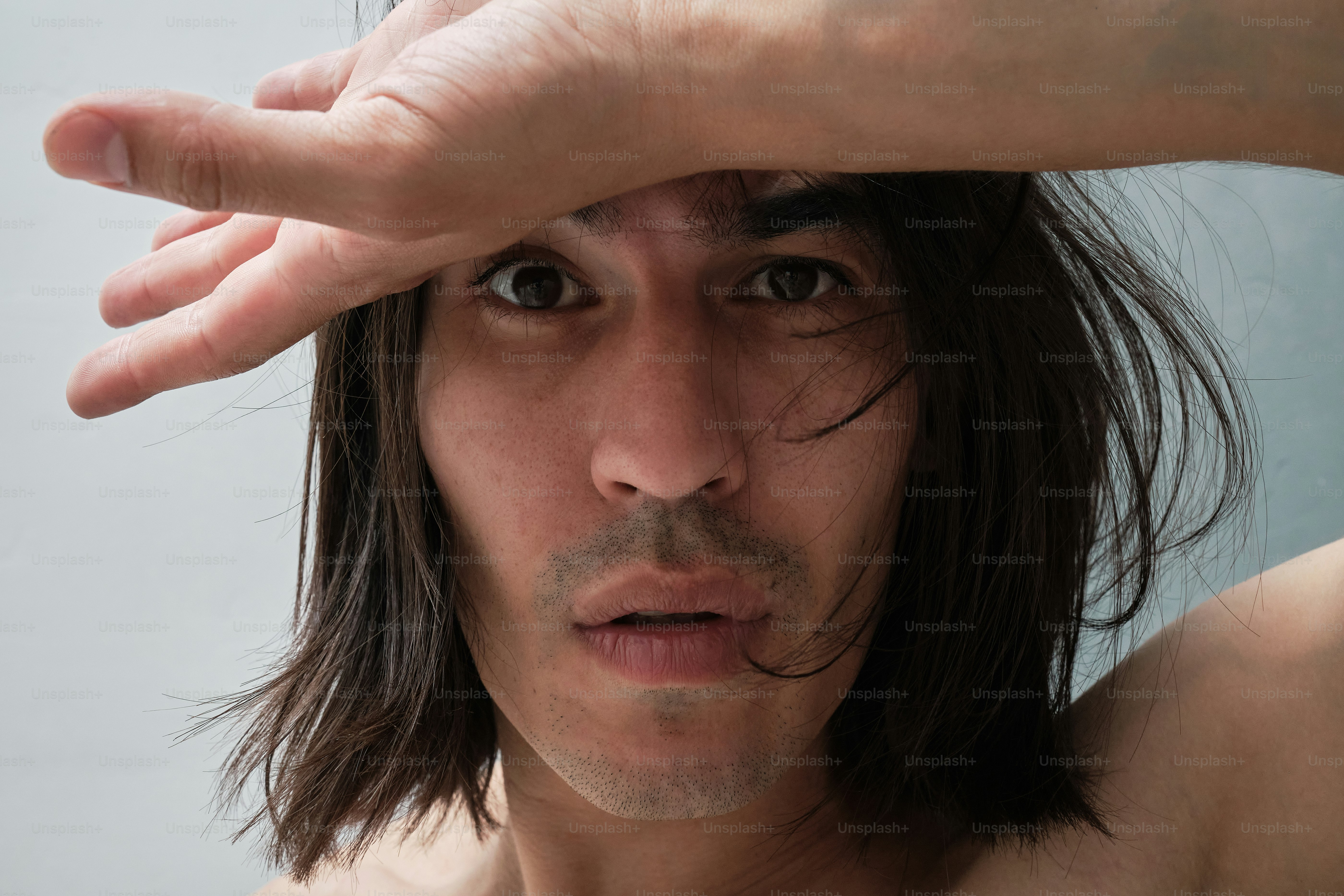 A shirtless man holding his hand over his head photo – Emotions face ...