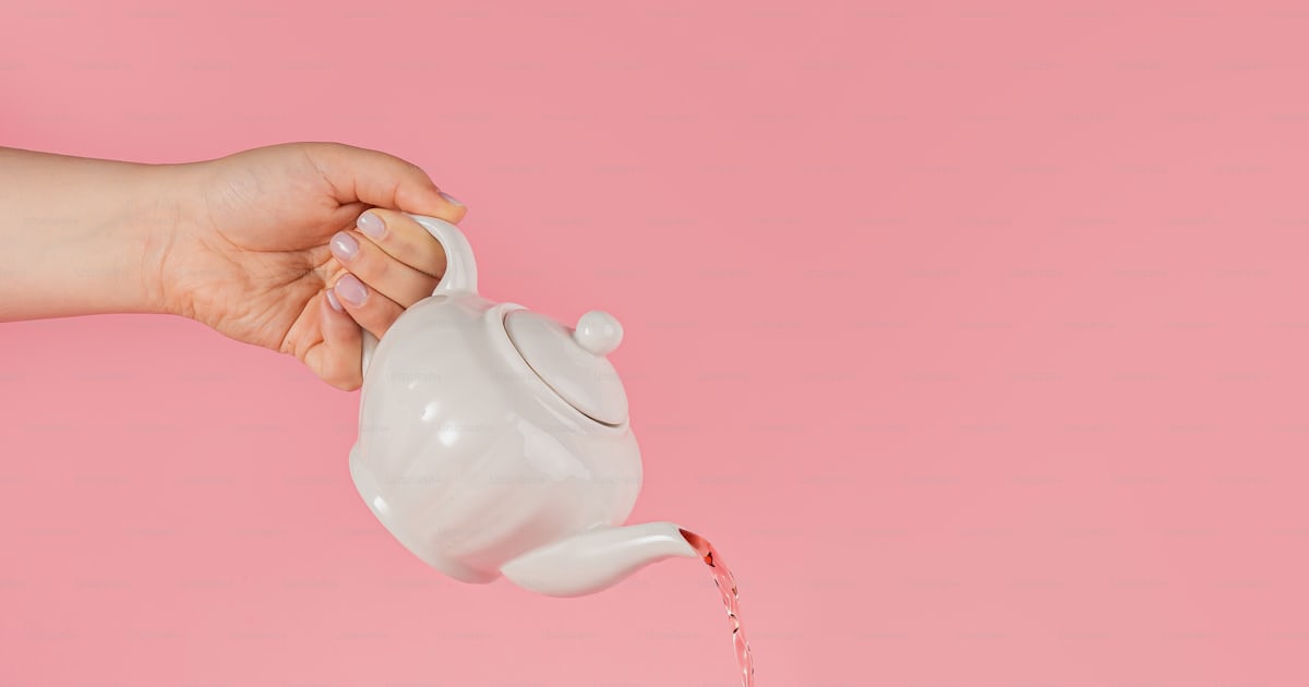 A Person Pouring Red Wine Into A Wine Glass Photo Teapot Image On