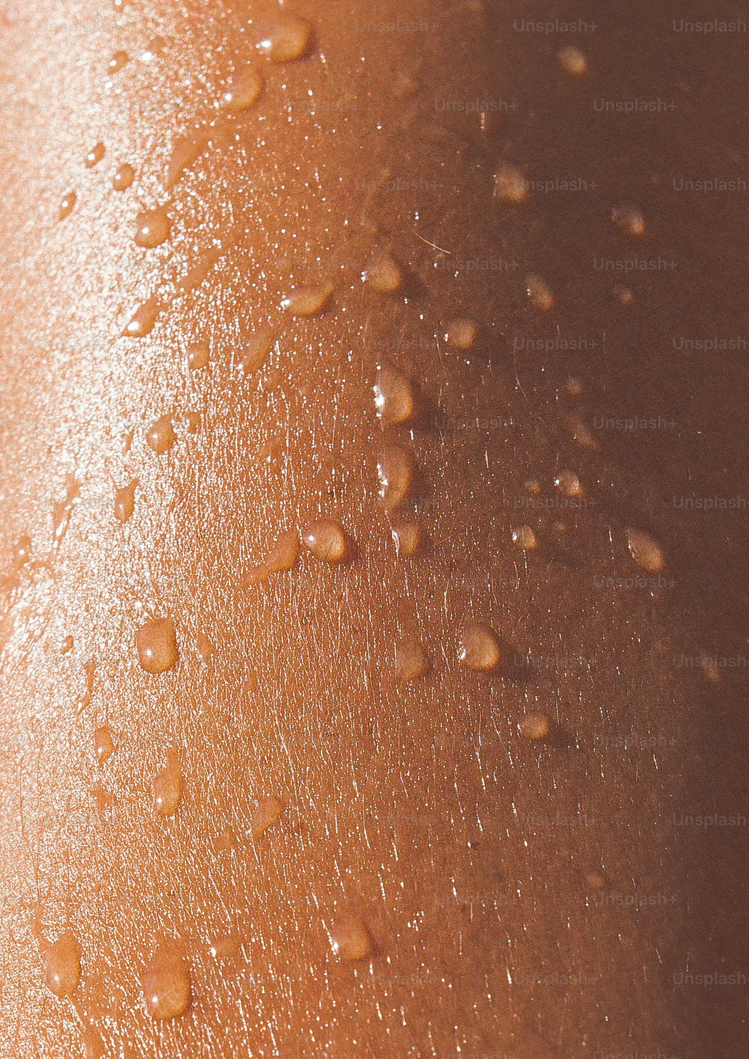 A close up of a person's butt with water drops on it photo – Sweating ...