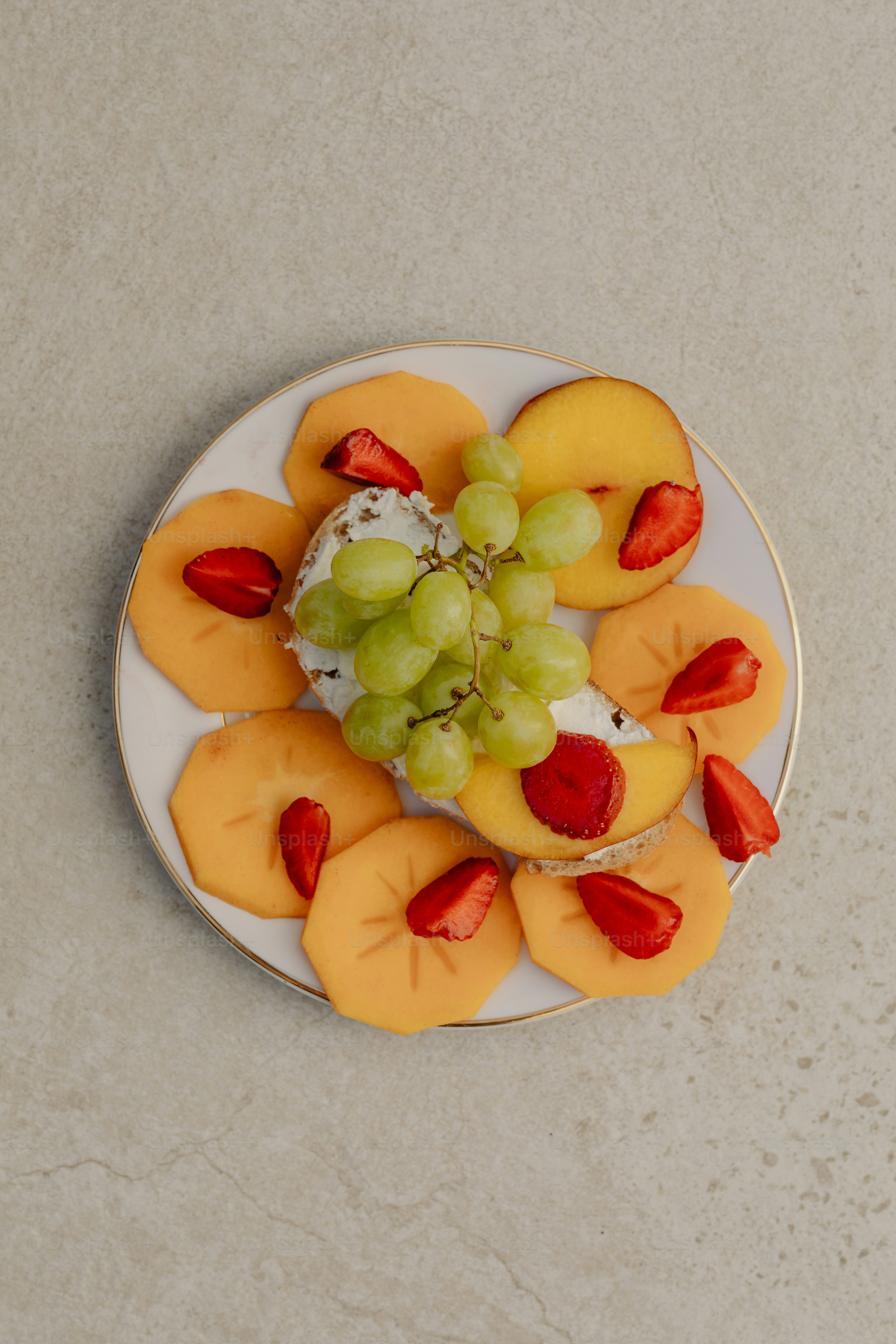 A White Plate Topped With Fruit And Cheese Photo – Fresh Fruits Image 