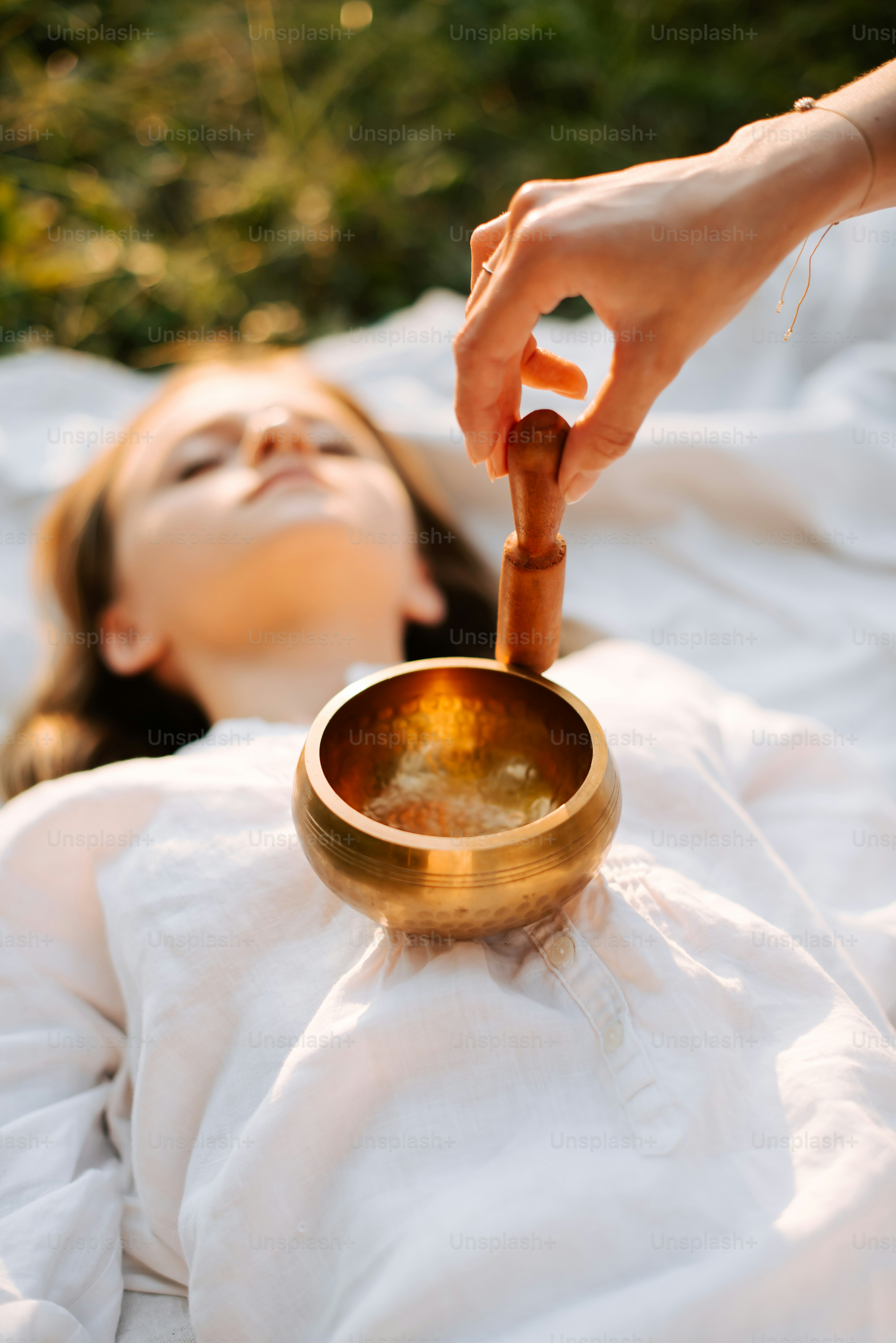 A wooden bowl sitting on top of a tree stump photo – Sound healing ...