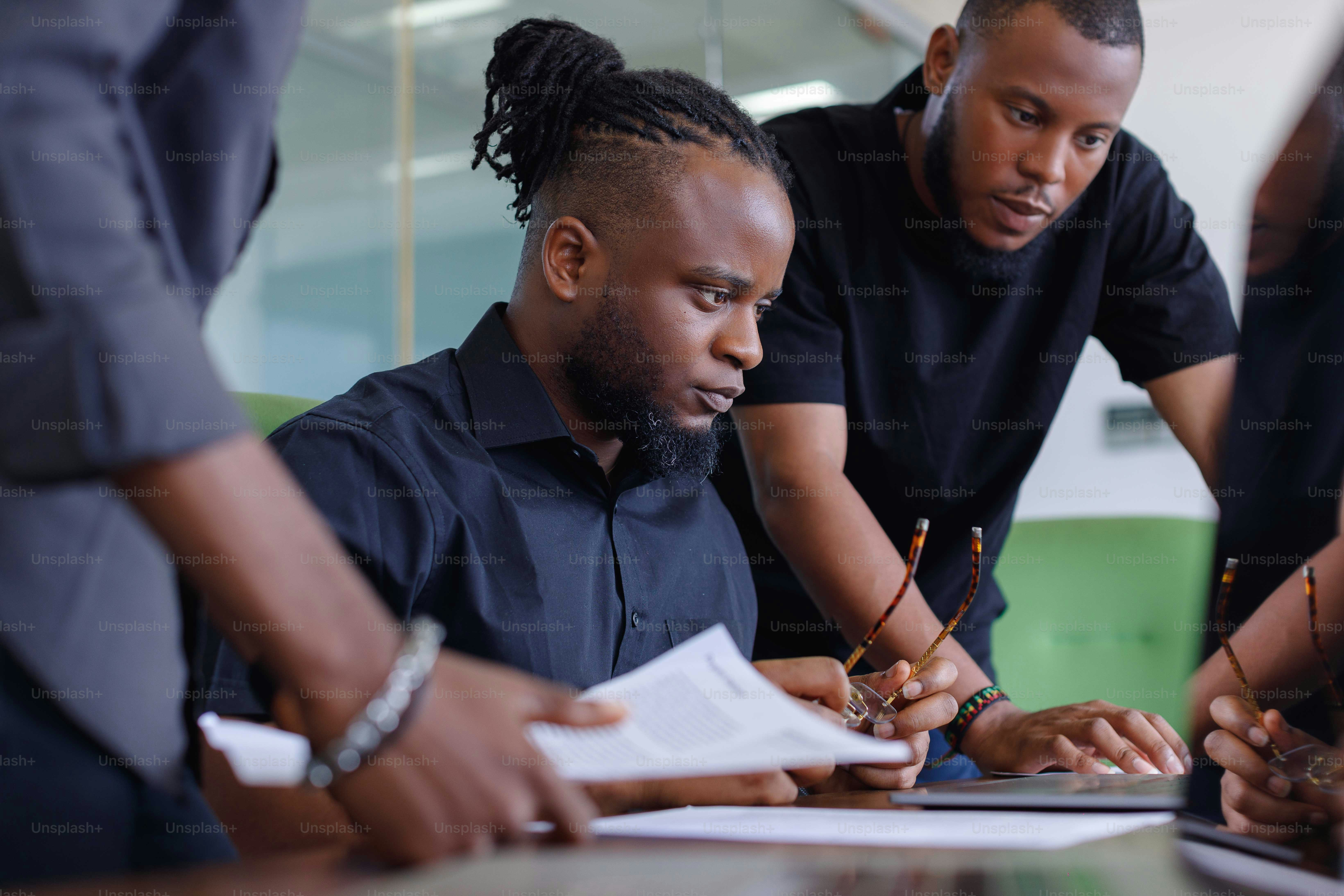 A group of people sitting around a computer photo – Hacker Image on ...