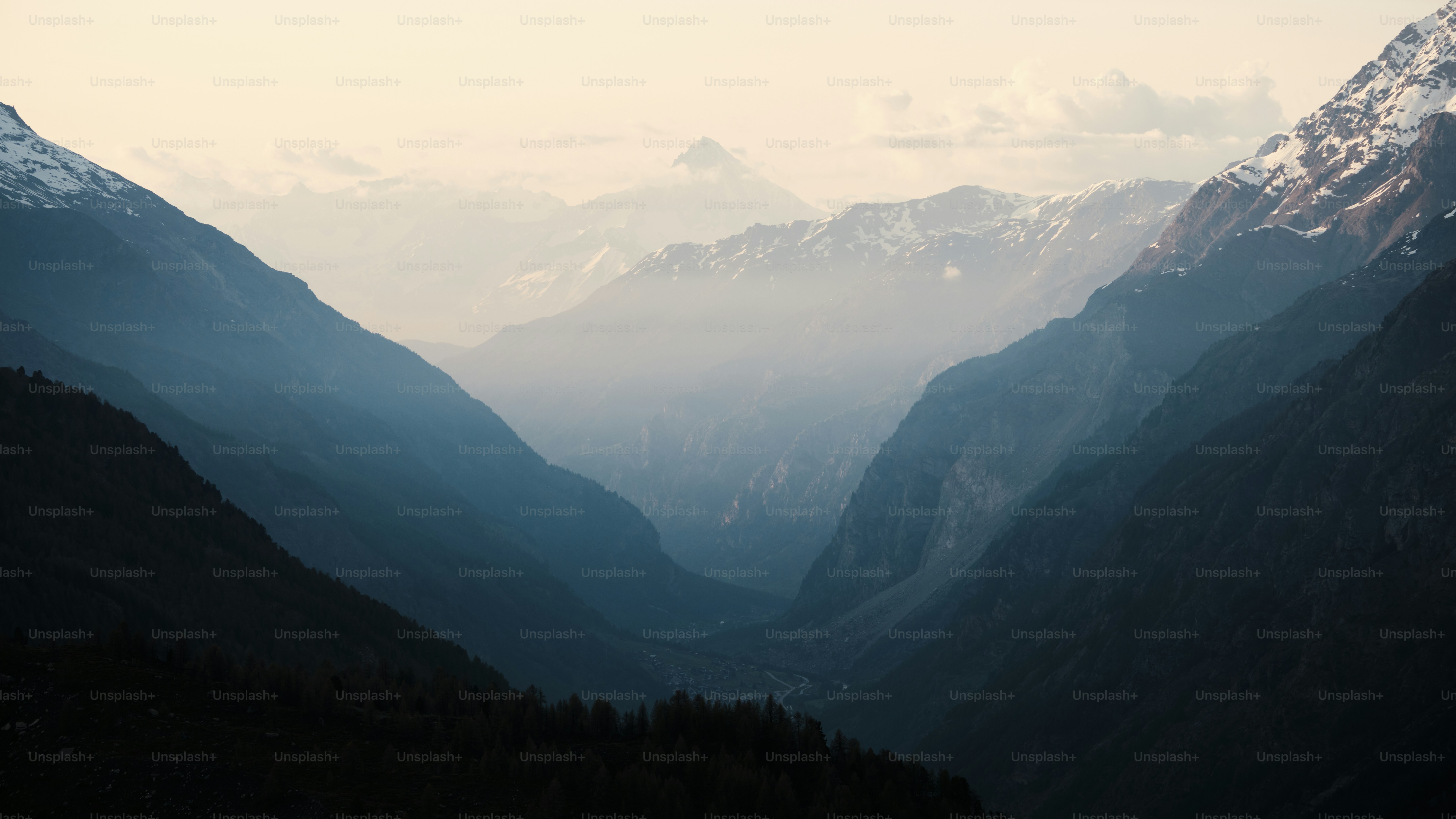 A view of a valley with mountains in the background photo – Switzerland ...