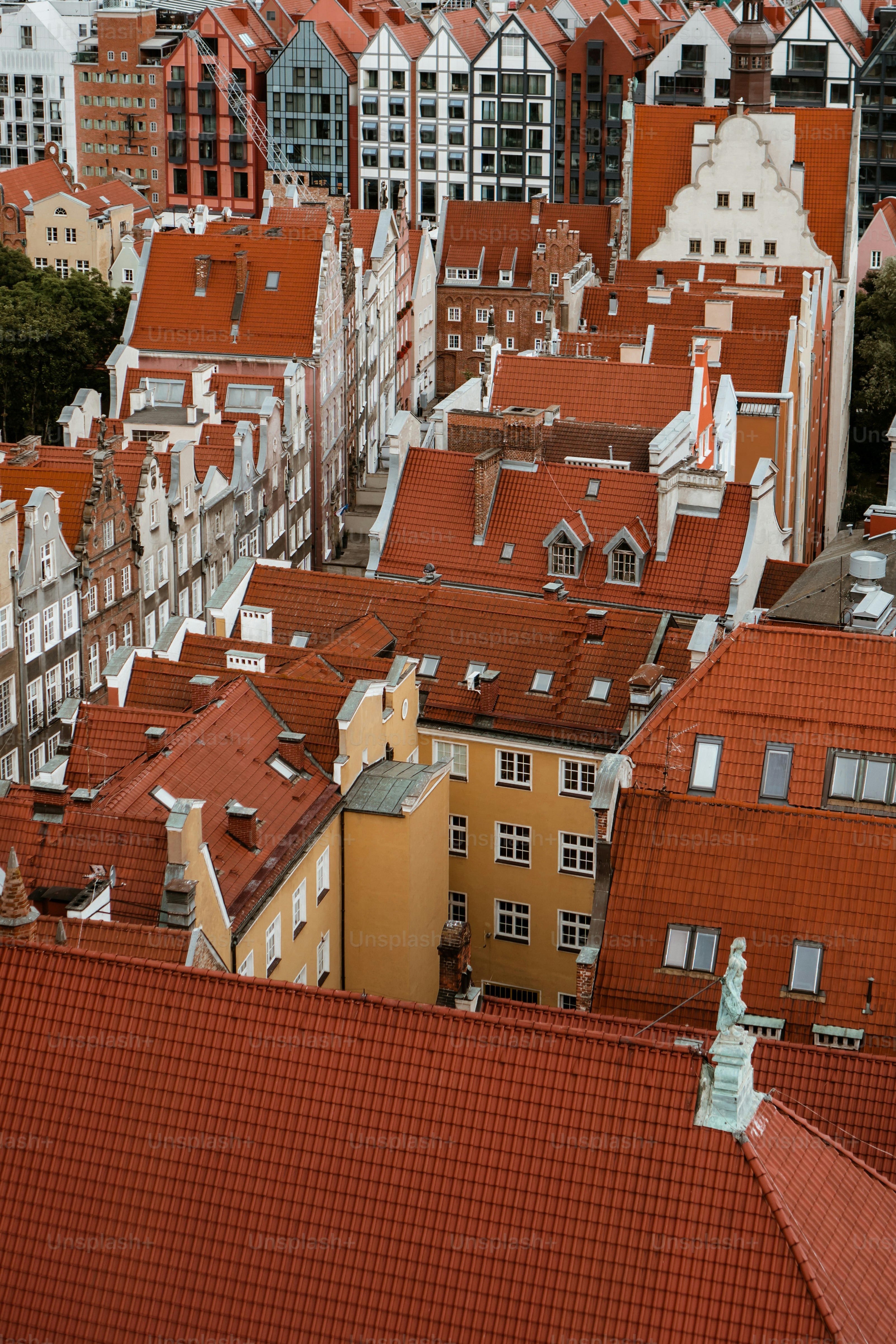 A view of a city from a high point of view photo – House roof Image on ...