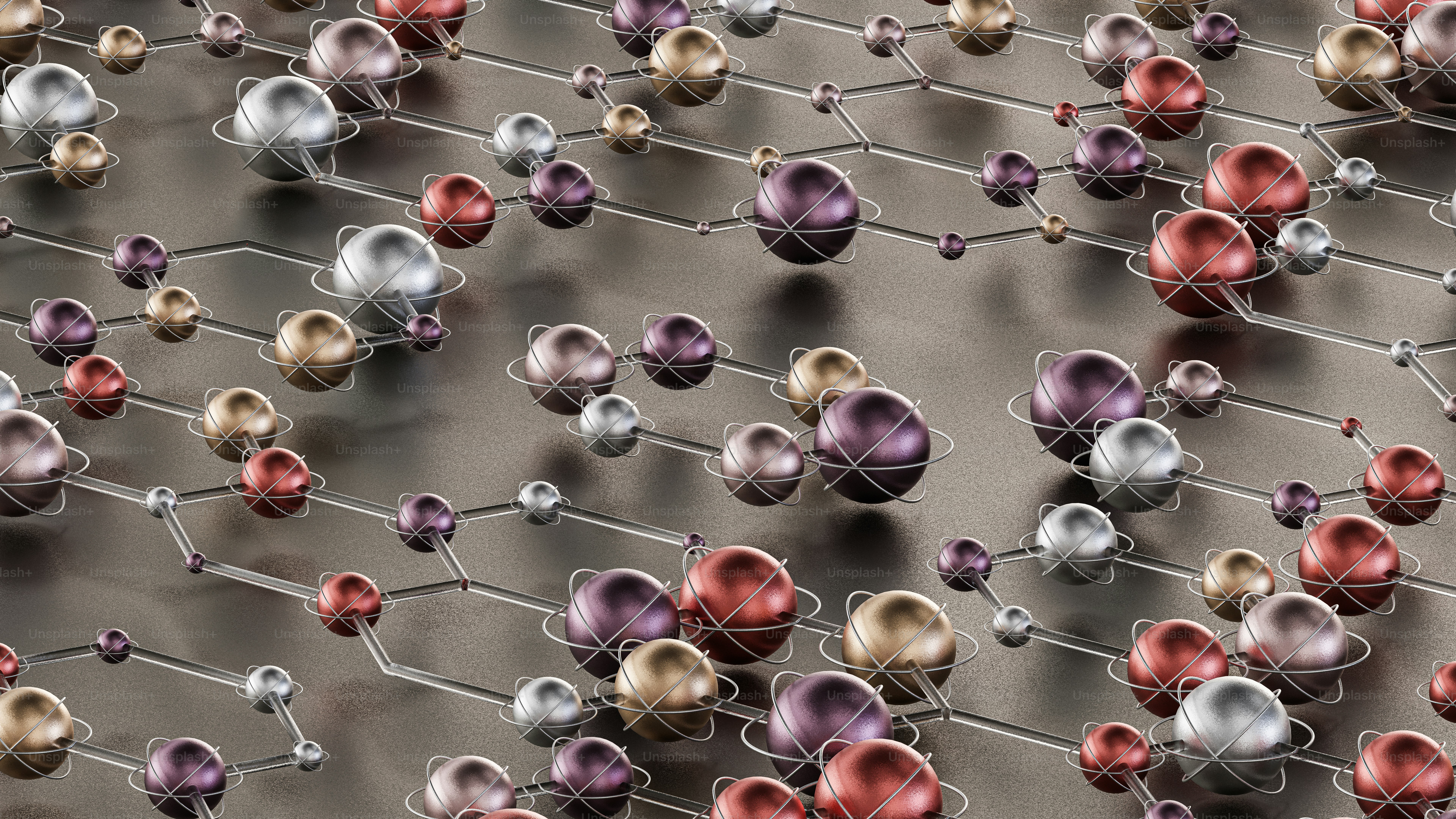 A group of metal balls with different colors on them photo – Quantum ...