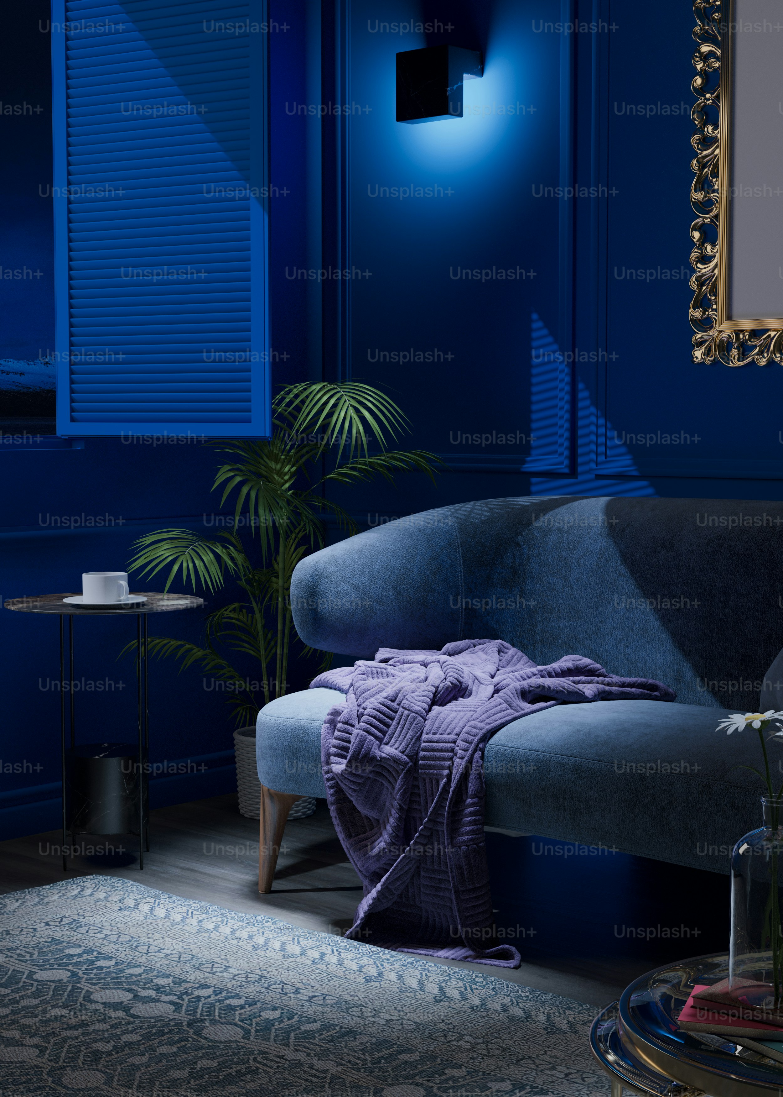 A living room with blue walls and a blue couch photo – Interior room ...