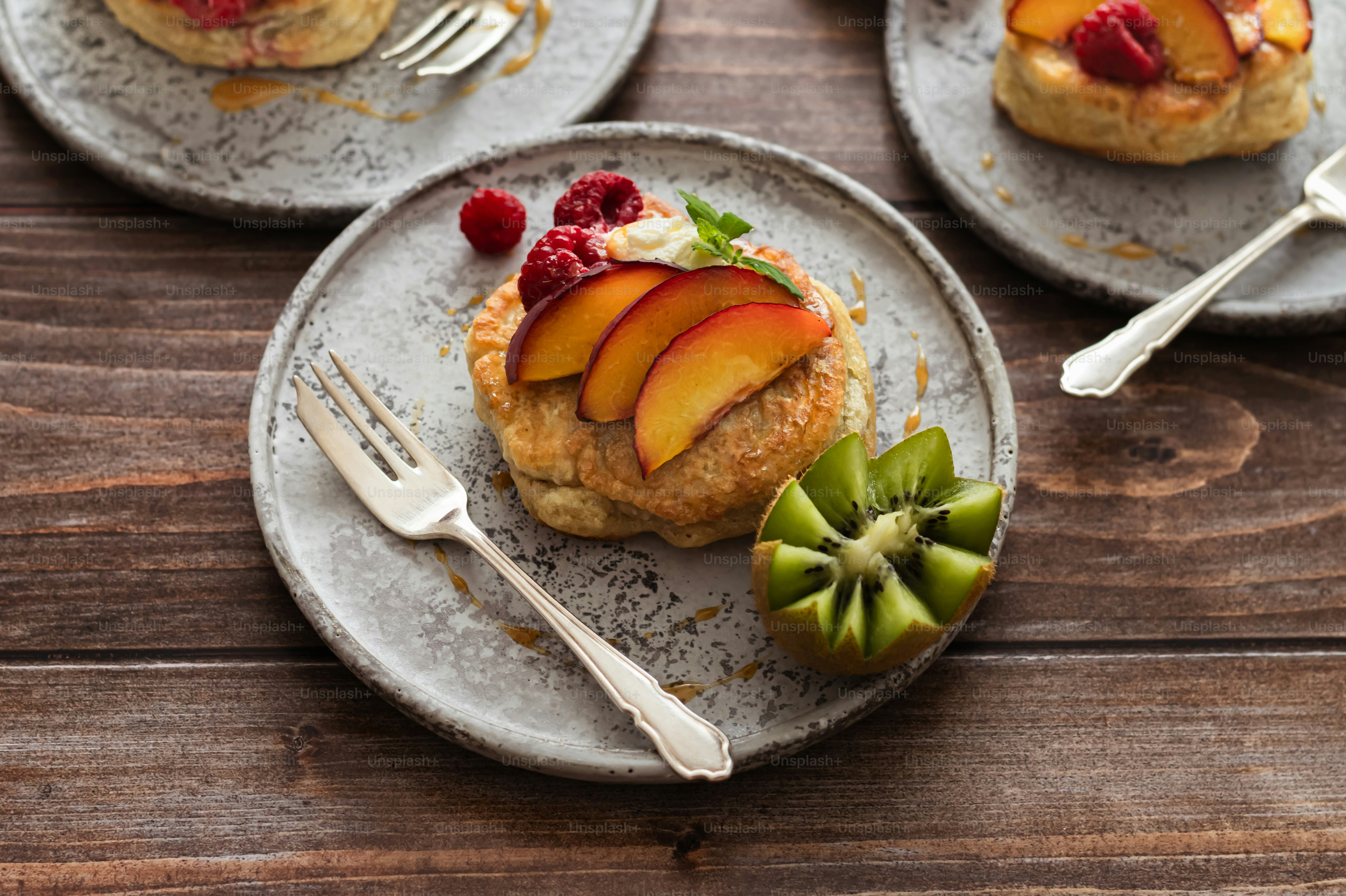 A couple of plates that have some food on them photo – Kiwi Image on ...