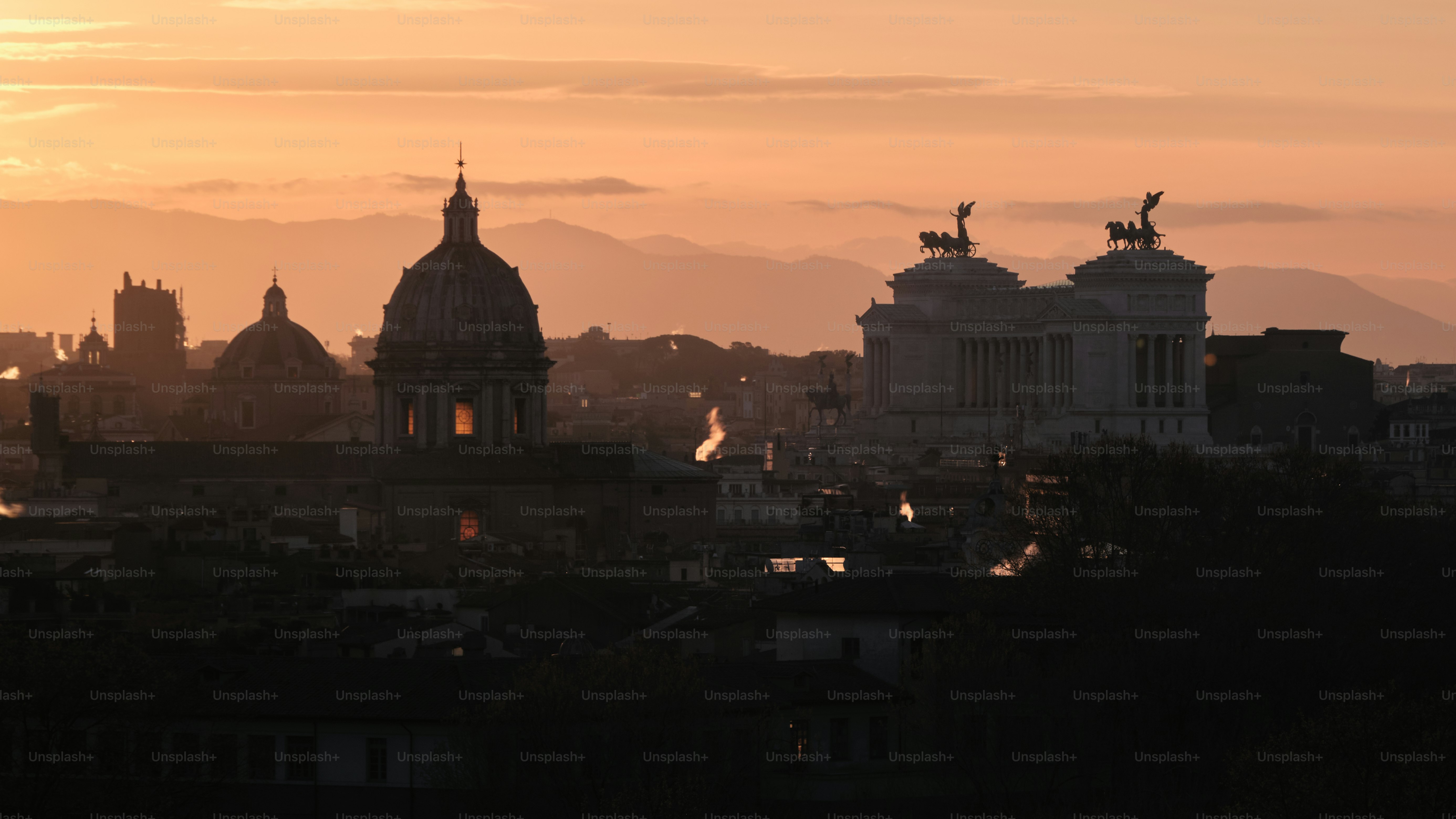 The sun is setting over the city of rome photo – Rome Image on Unsplash