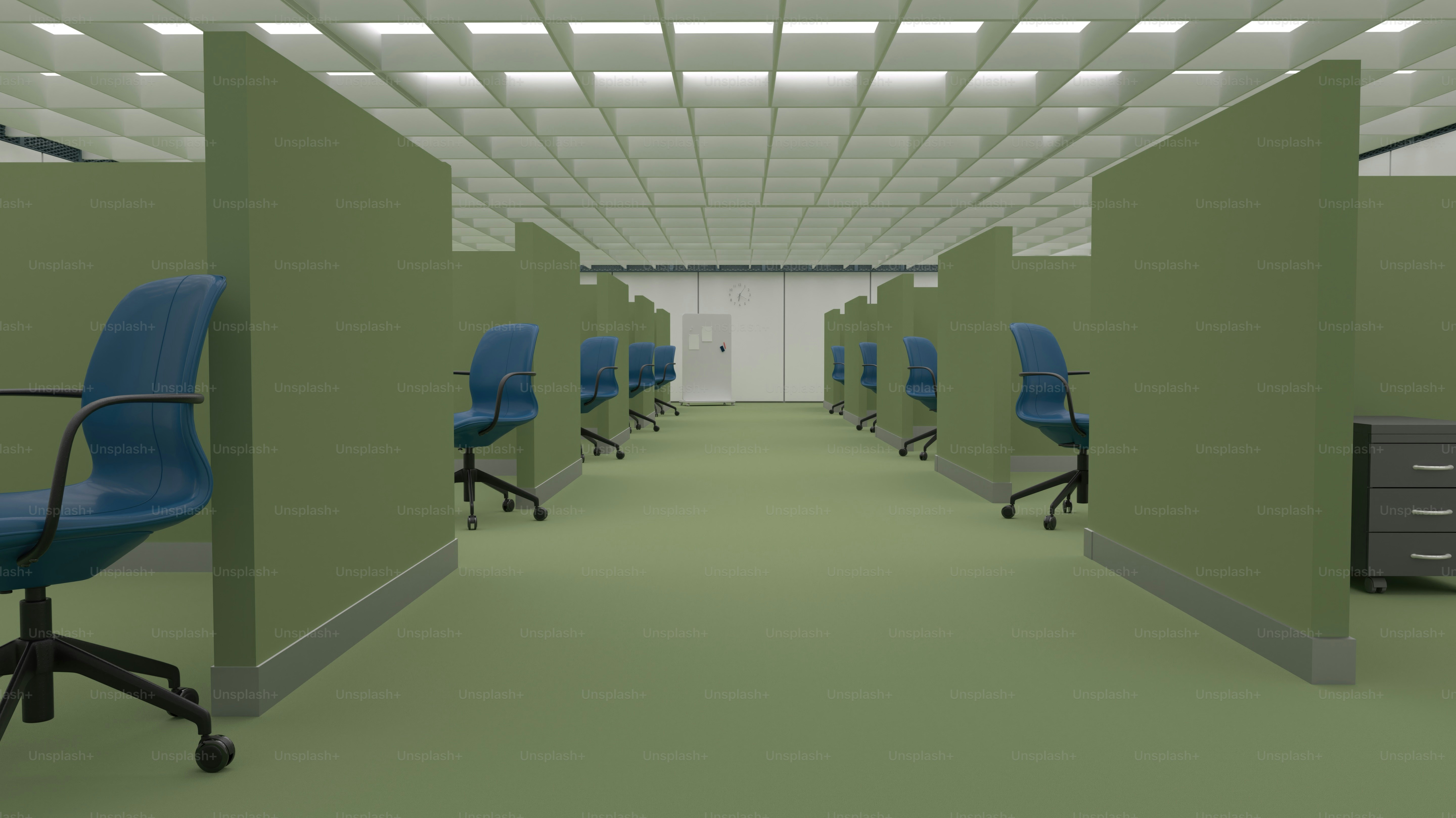 An office cubicle with blue chairs and white desks photo – Desk Image ...