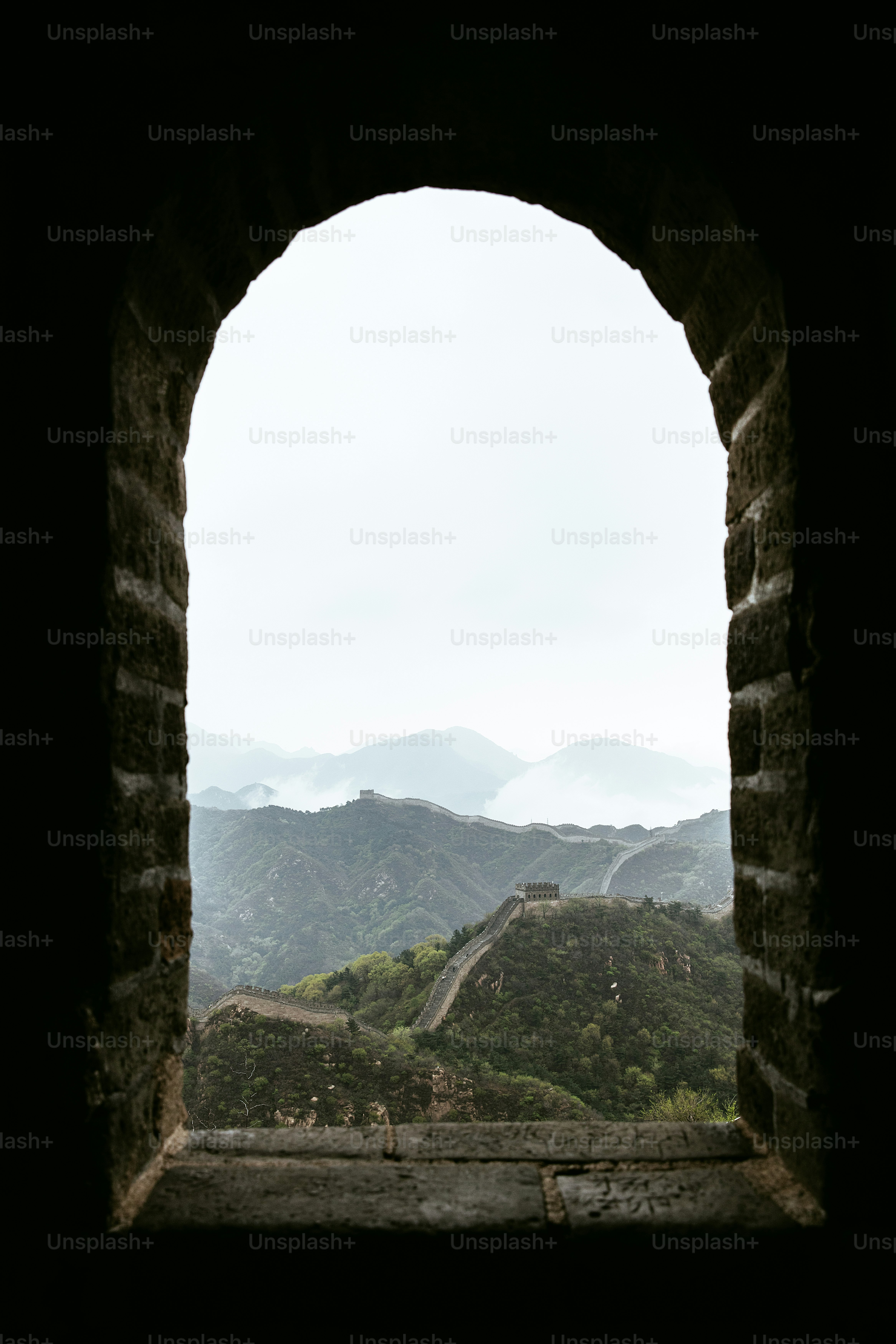 A view of the great wall of china through a window photo – Travel Image ...