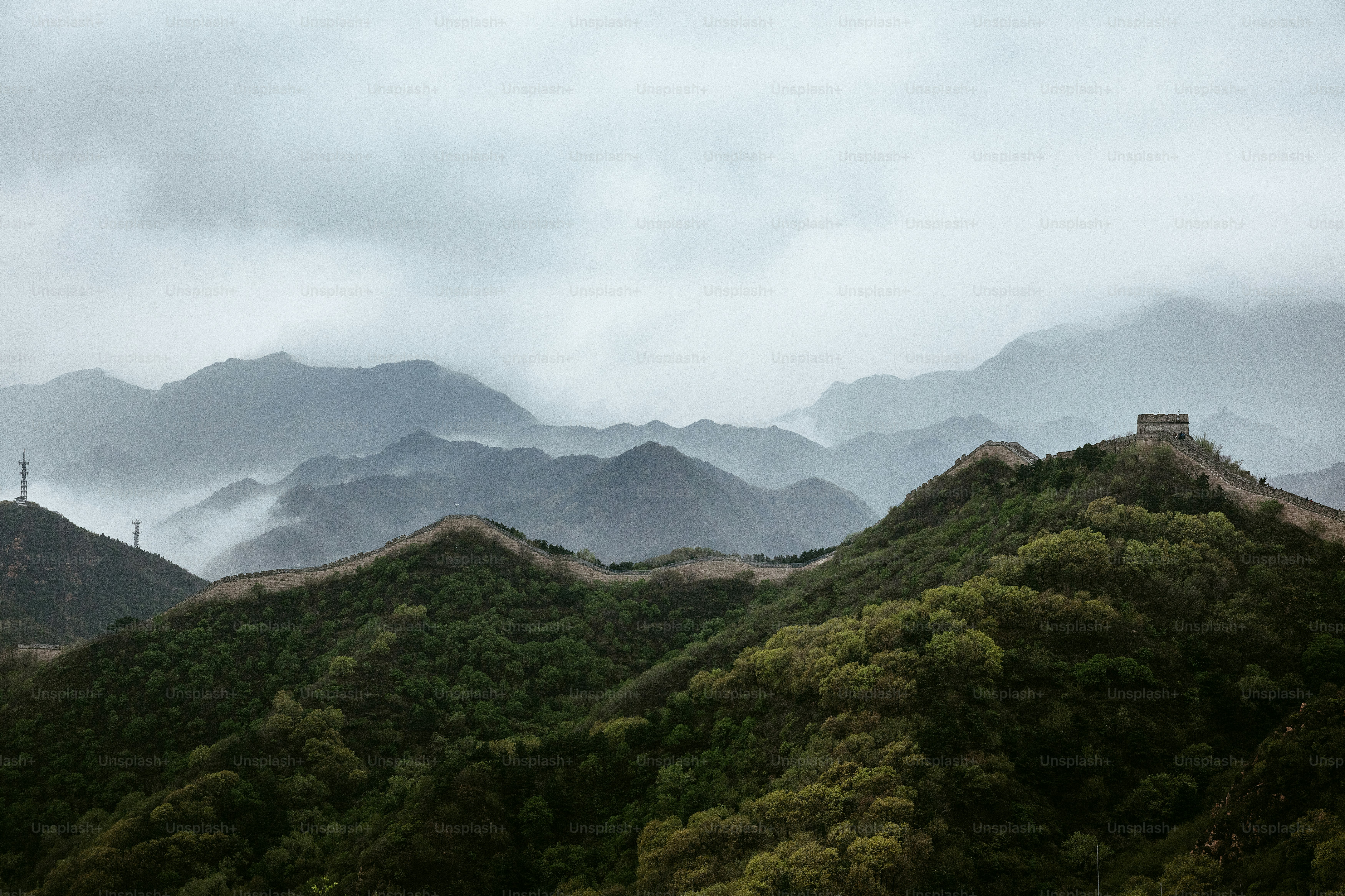 A view of the great wall of china from the top of a mountain photo ...
