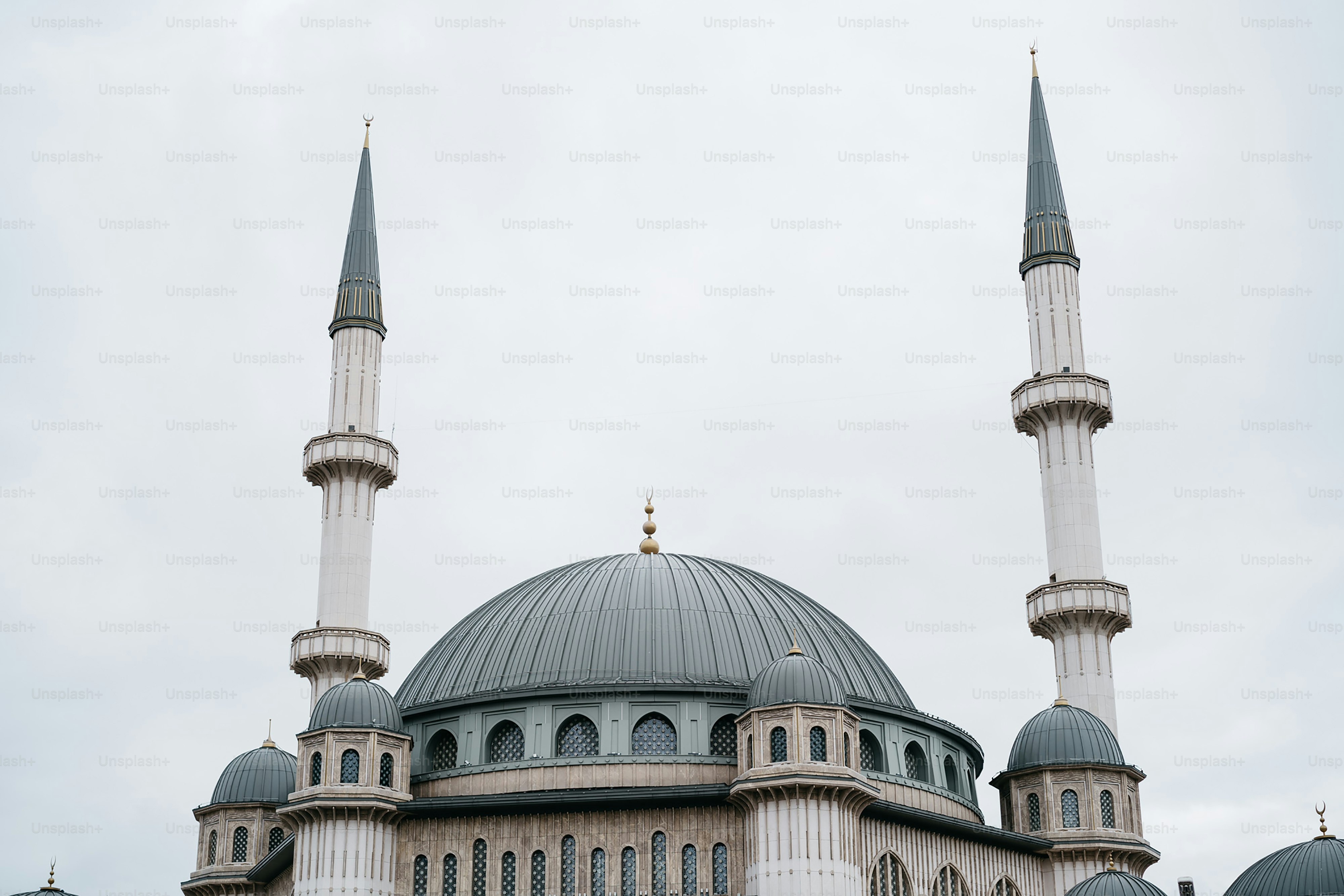 A large building with two towers and a dome photo – Mosque Image on ...