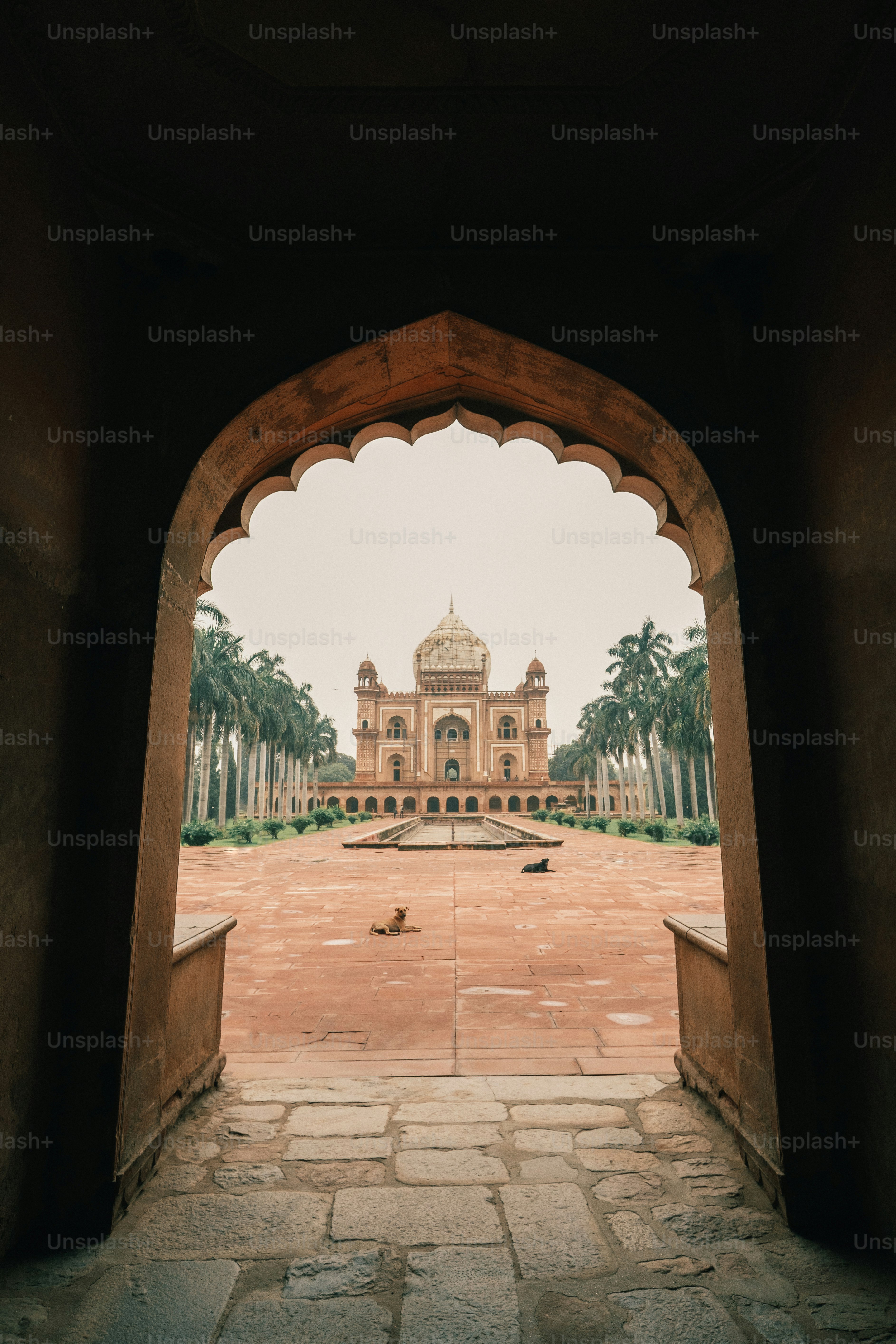 A view of a building through an archway photo – India Image on Unsplash