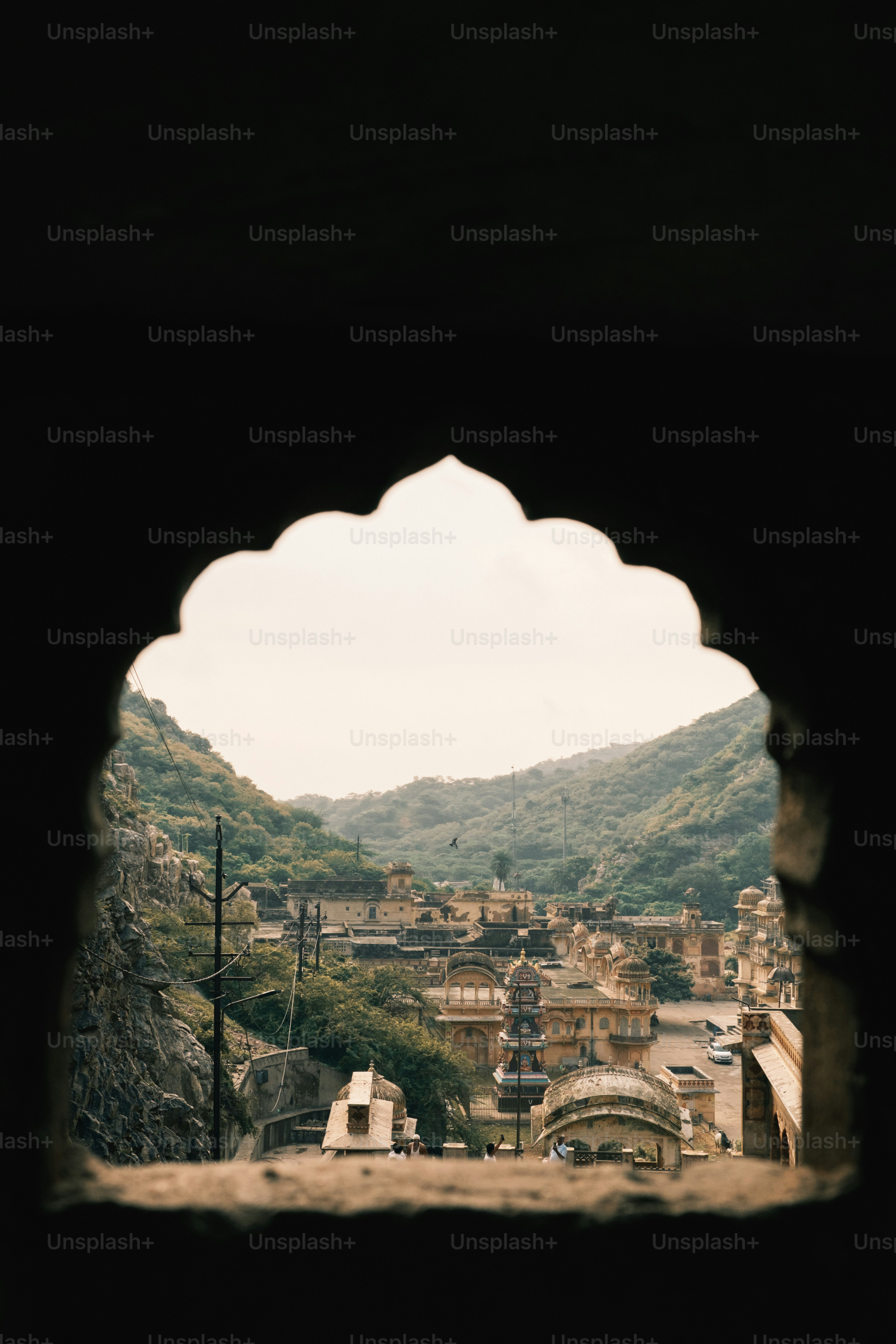 A view of a city from a window in a building photo – Outdoors Image on ...
