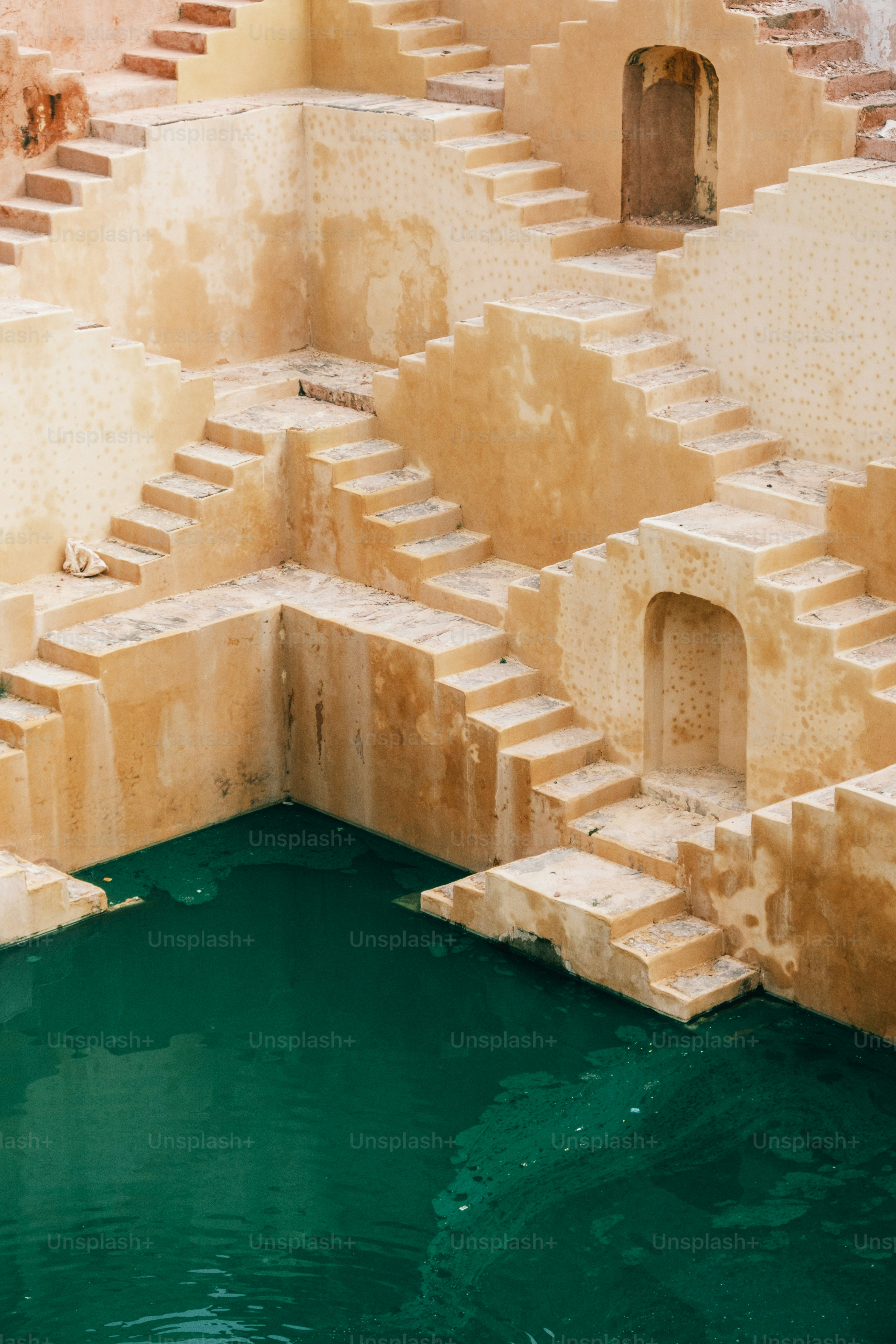 A large building with a staircase leading up to it photo – Landmark ...