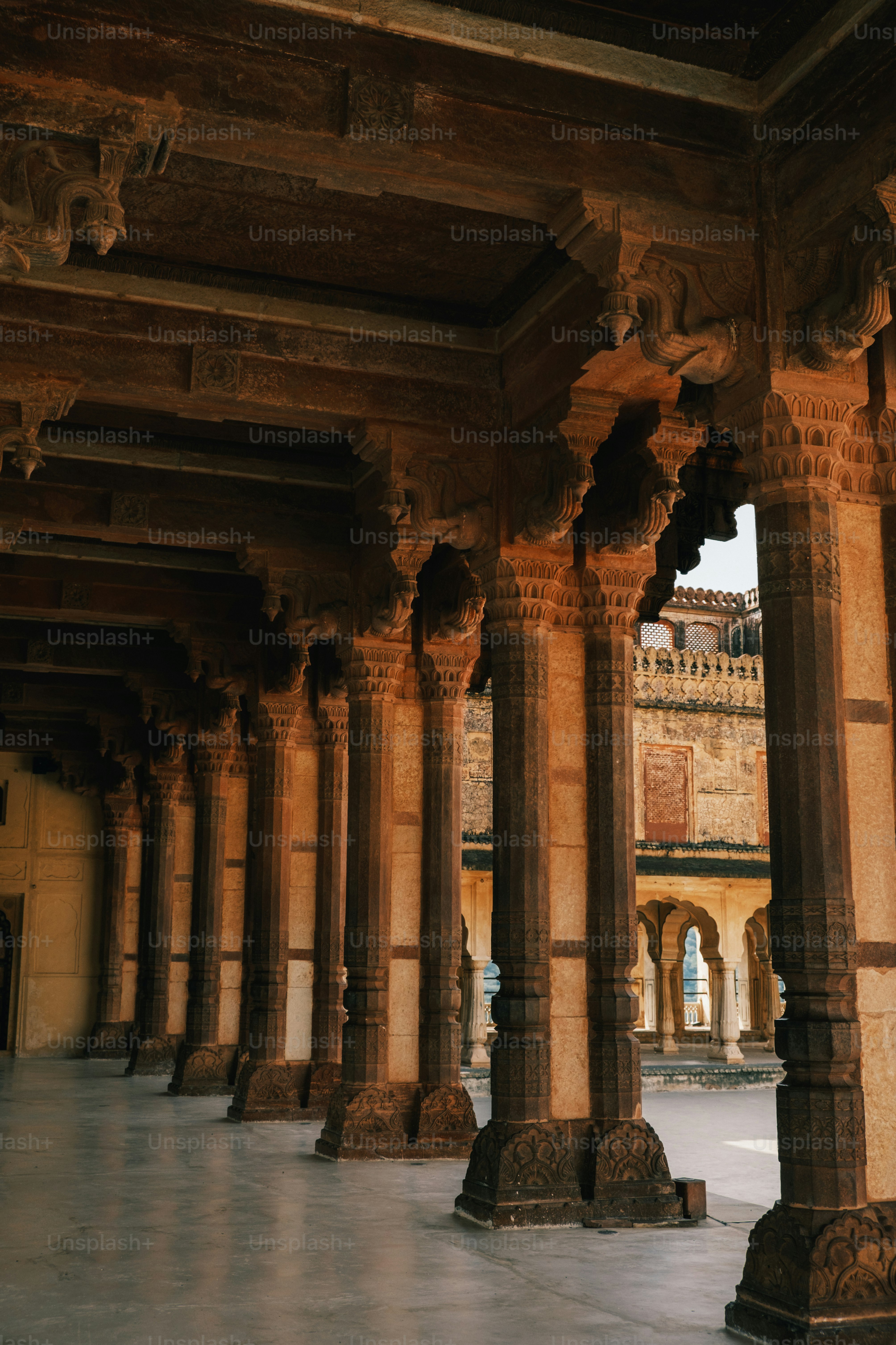 A large building with pillars and a clock tower in the background photo ...