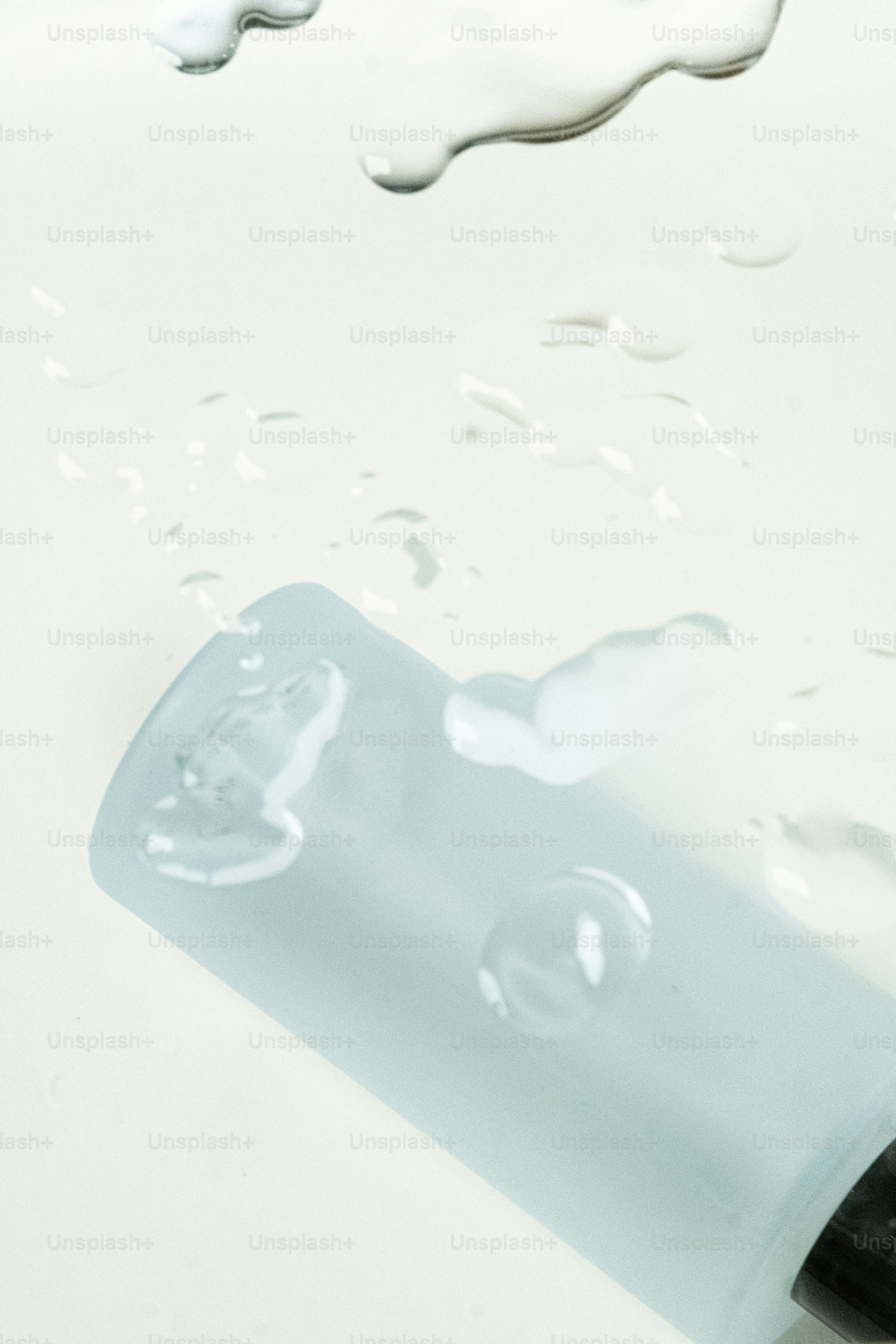 A tube of toothpaste sitting on top of a white table photo – Cosmetics ...