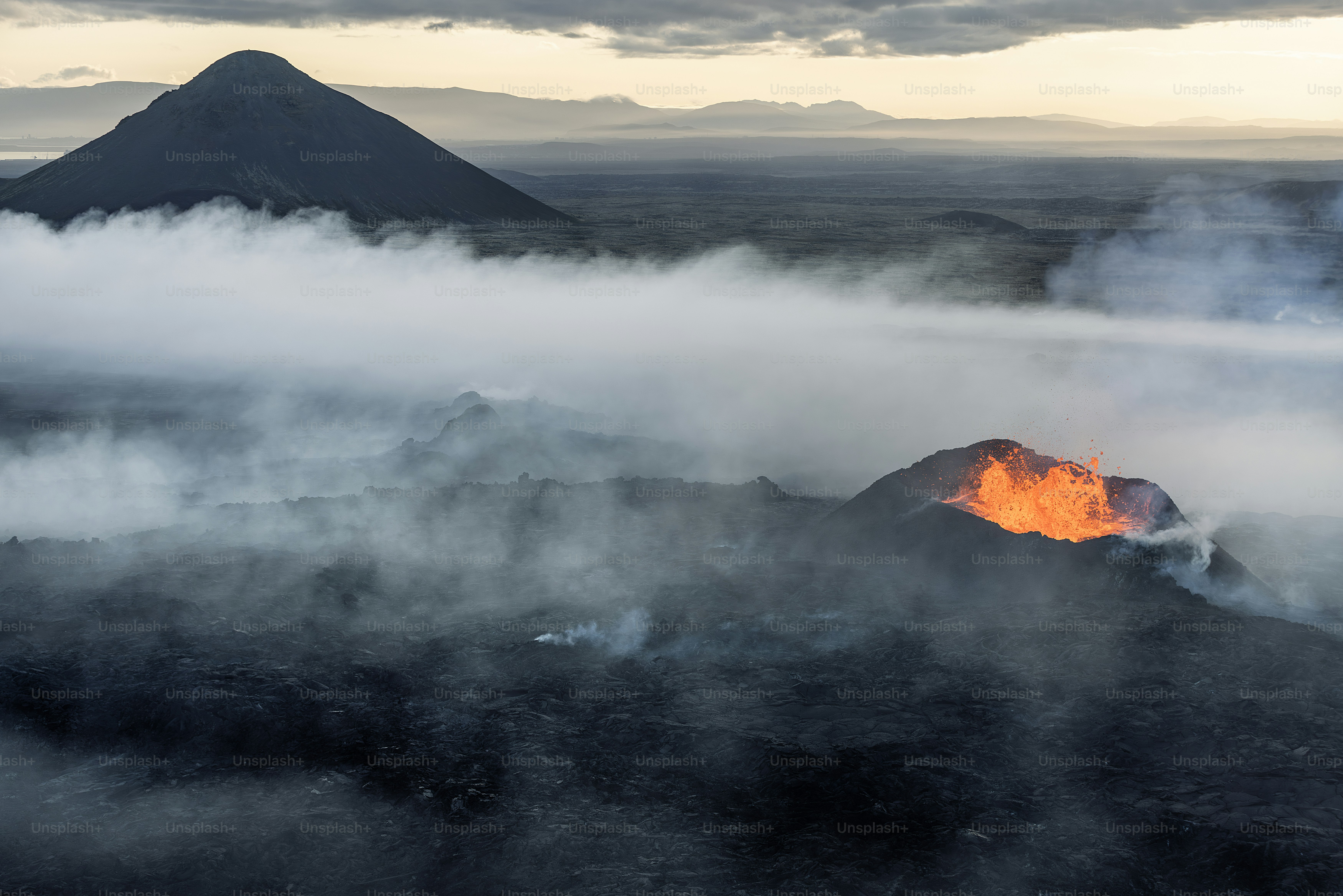 A volcano spewing out lava into the air photo – Iceland Image on Unsplash