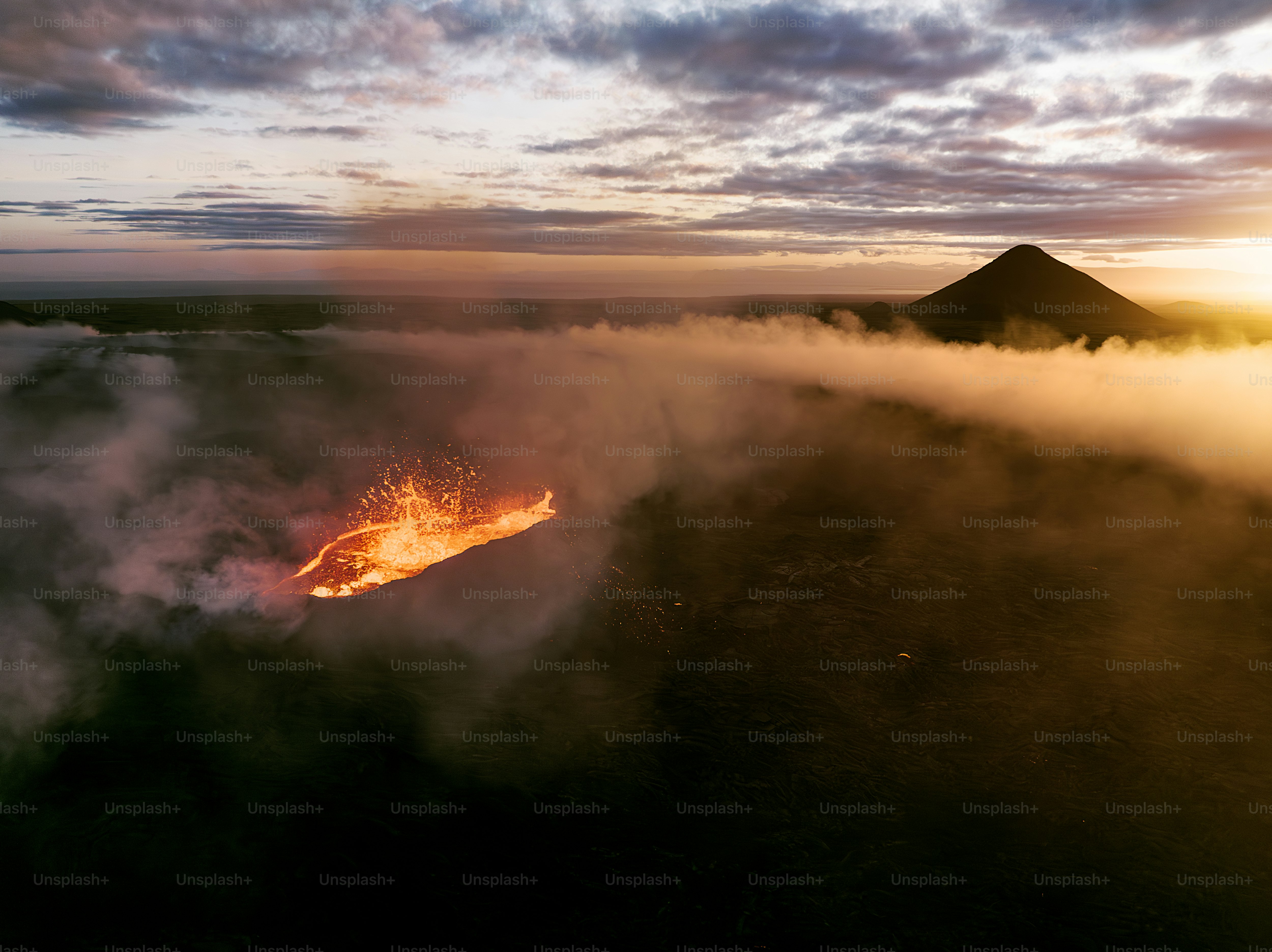 A volcano spewing out lava at sunset photo – Iceland Image on Unsplash