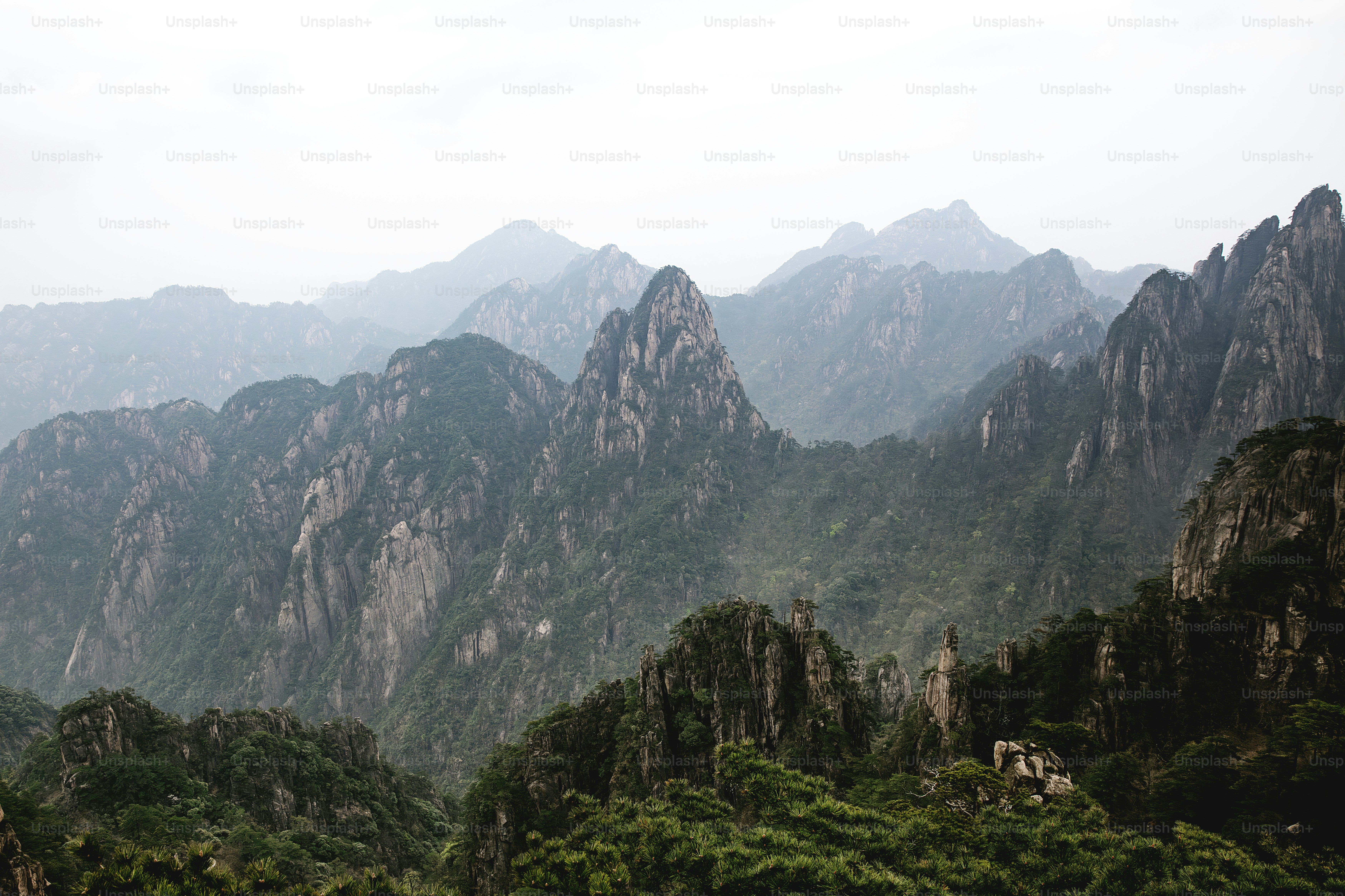 A view of a mountain range from a distance photo – Huangshan Image on ...