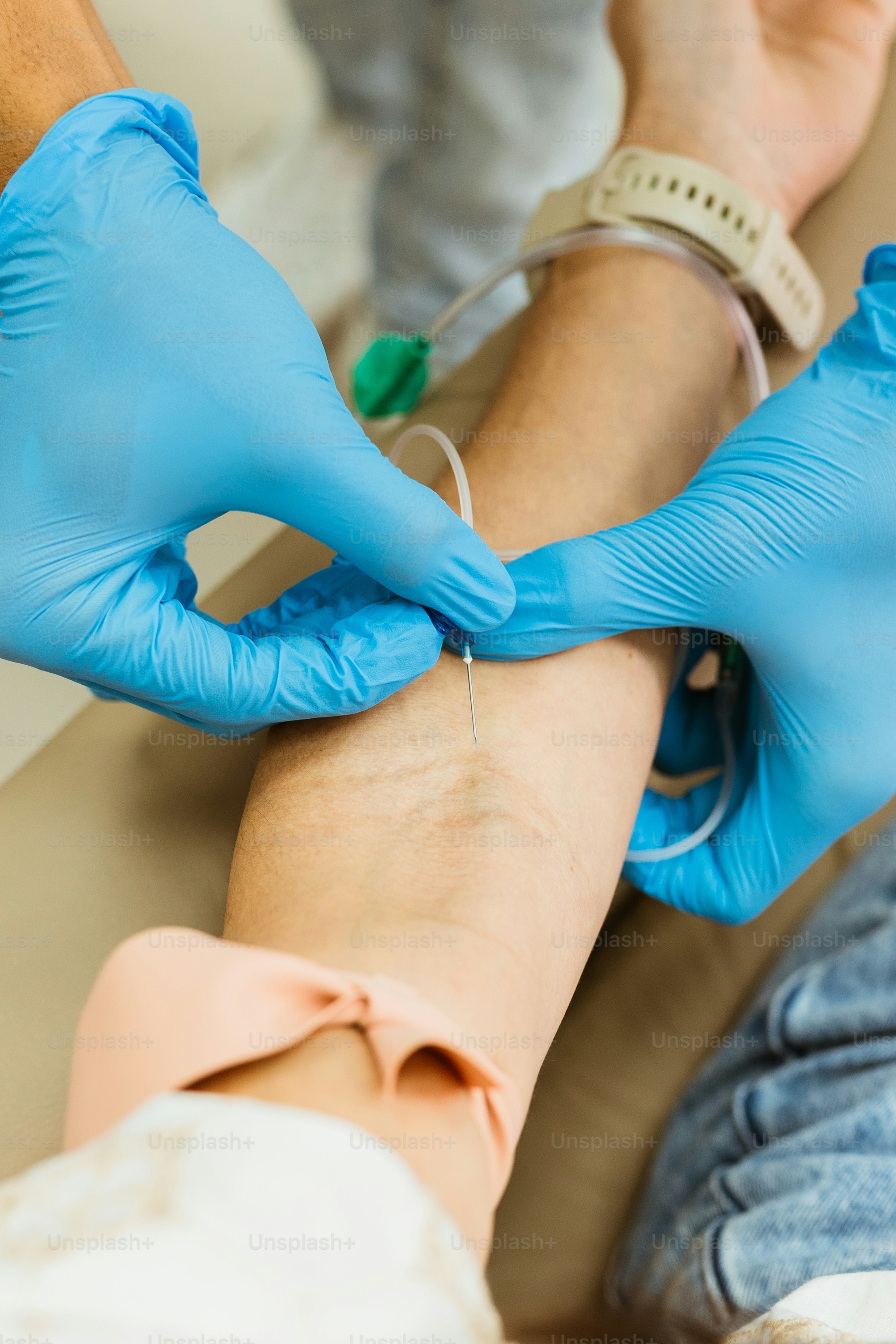 A person in blue gloves is getting an iv photo – Medication Image on ...
