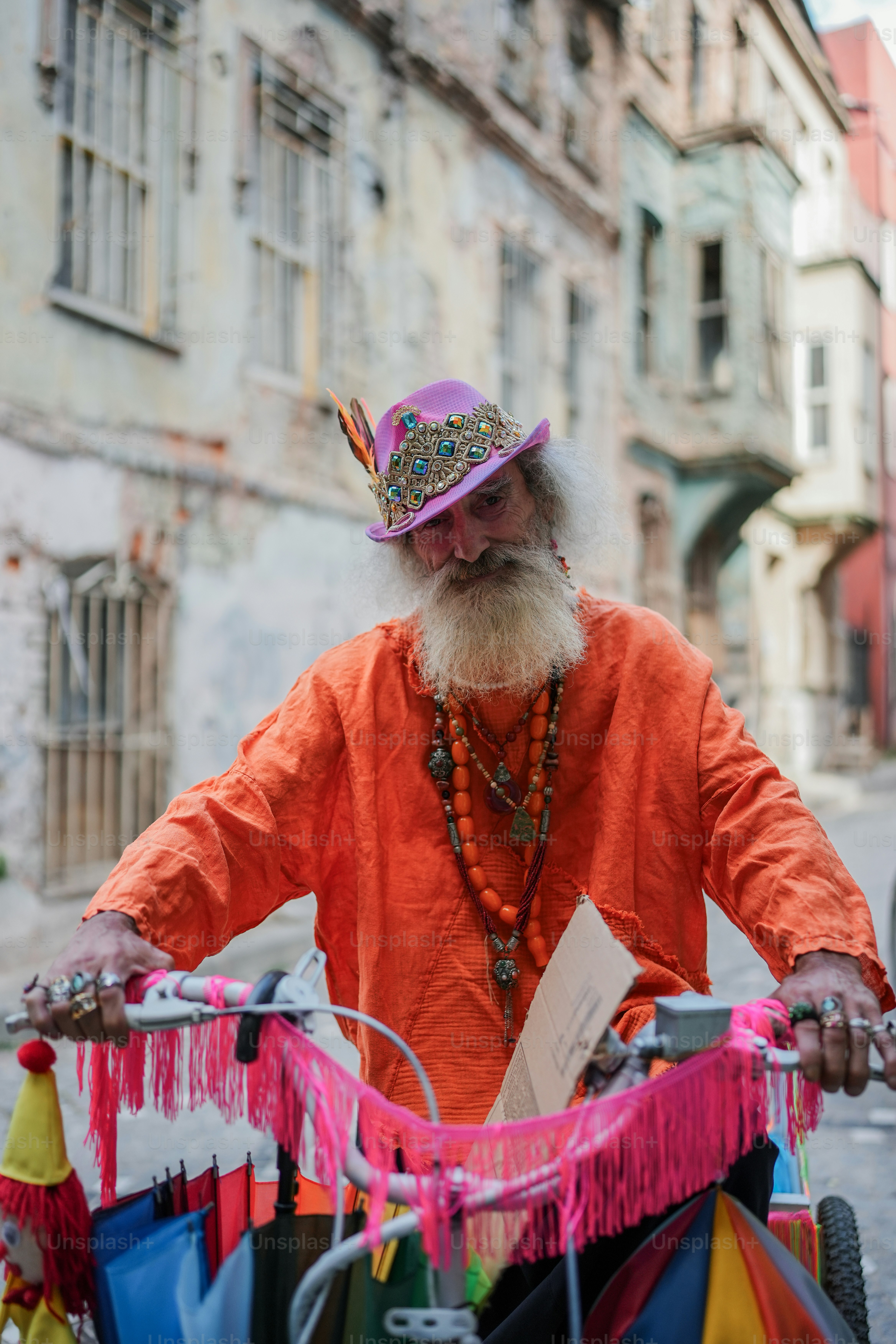 A man with a long beard riding a bike photo – Man Image on Unsplash