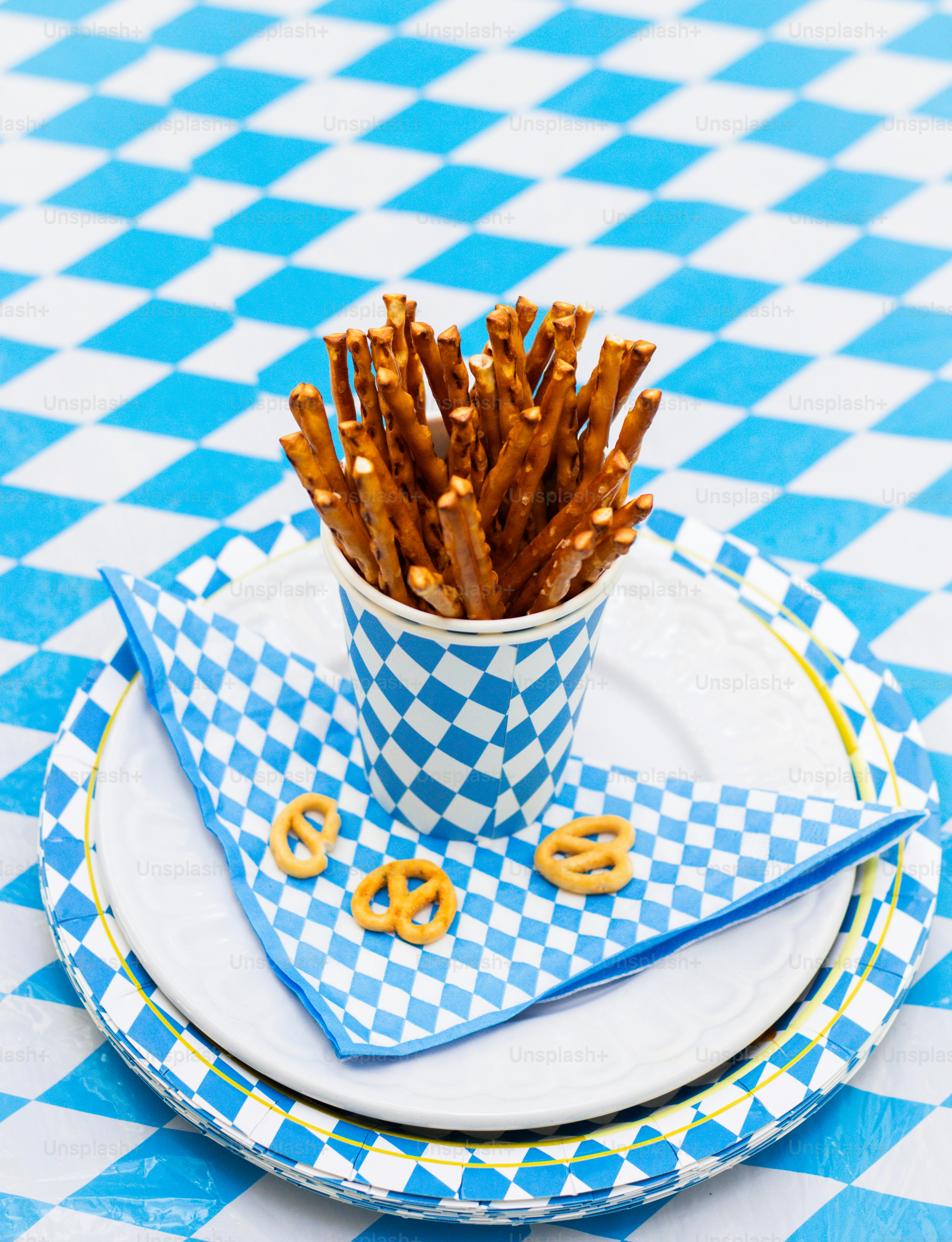 A blue and white checkered table cloth with a blue and white checkered ...