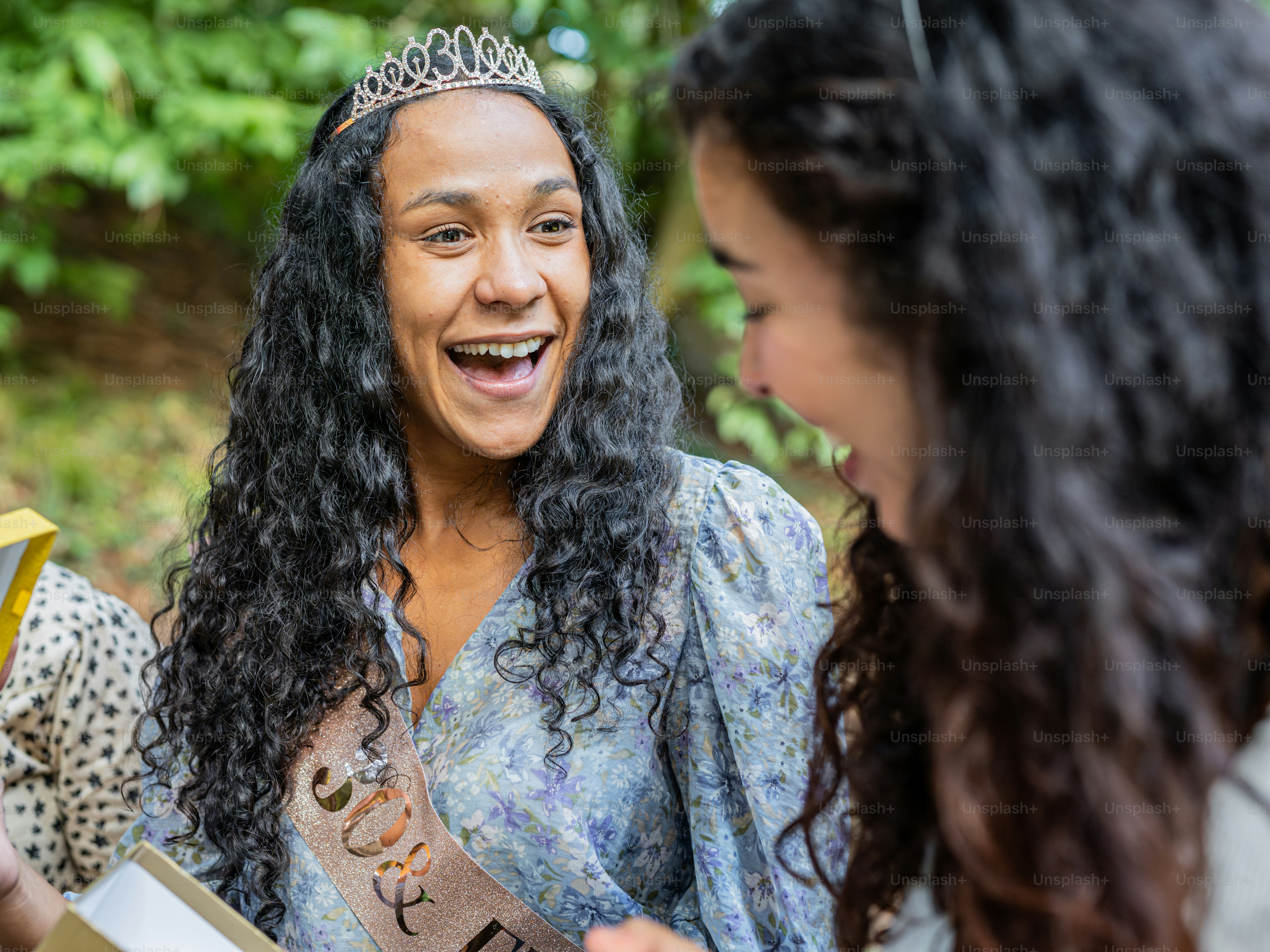 A woman wearing a tiara and smiling at another woman photo – Birthday ...