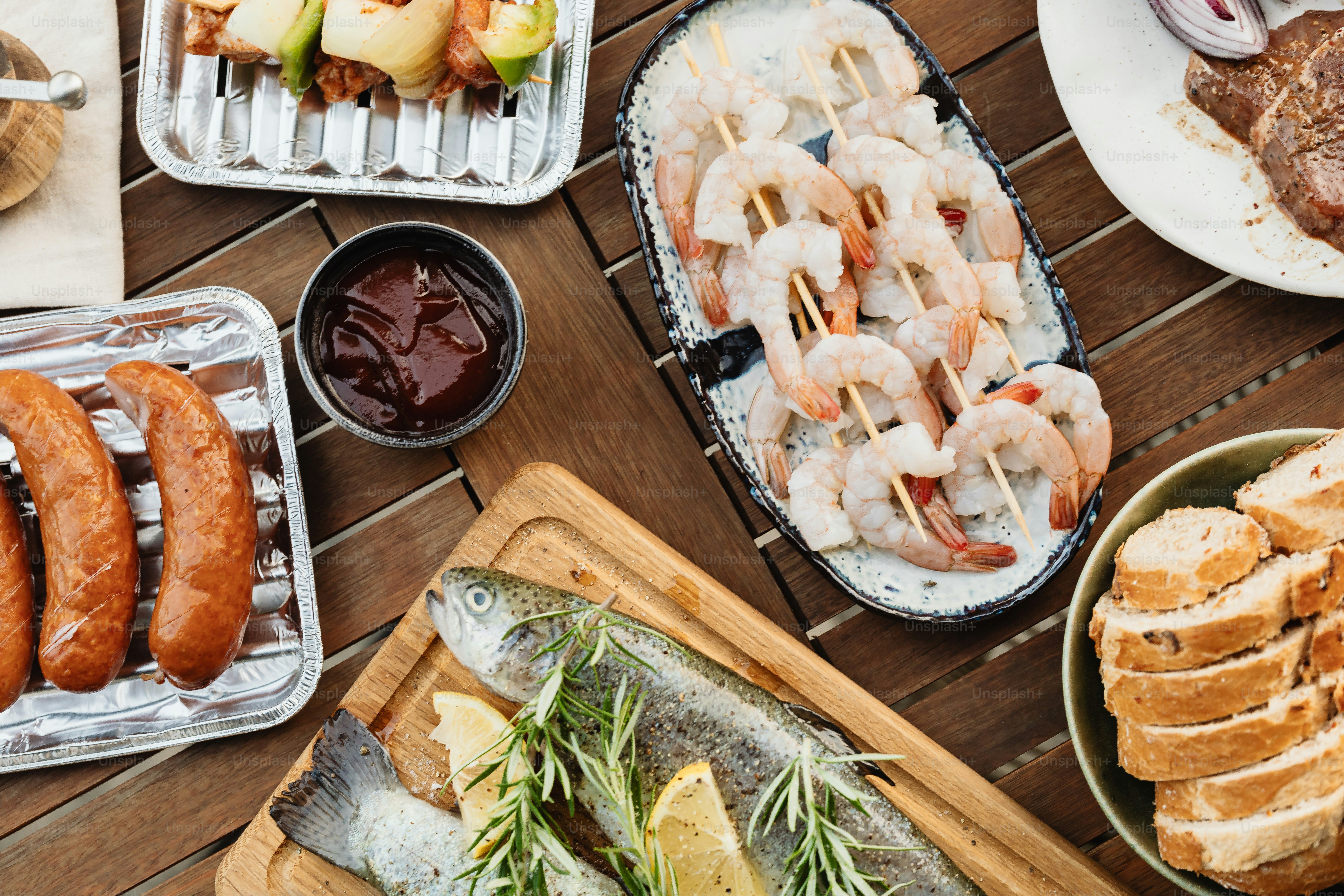 A wooden table topped with lots of food photo – Bbq Image on Unsplash