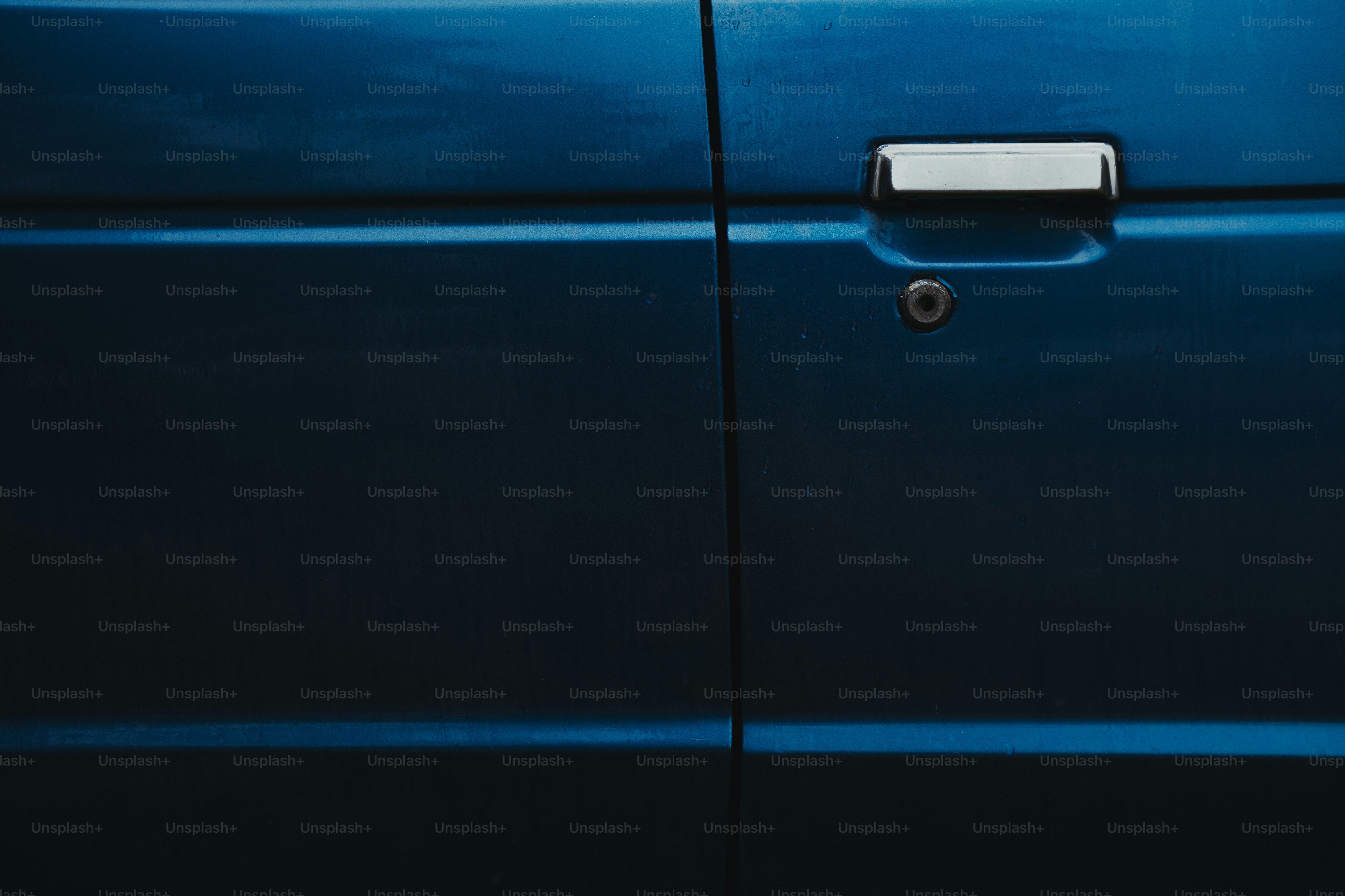 A close up of a blue car door handle photo – Car exterior Image on Unsplash